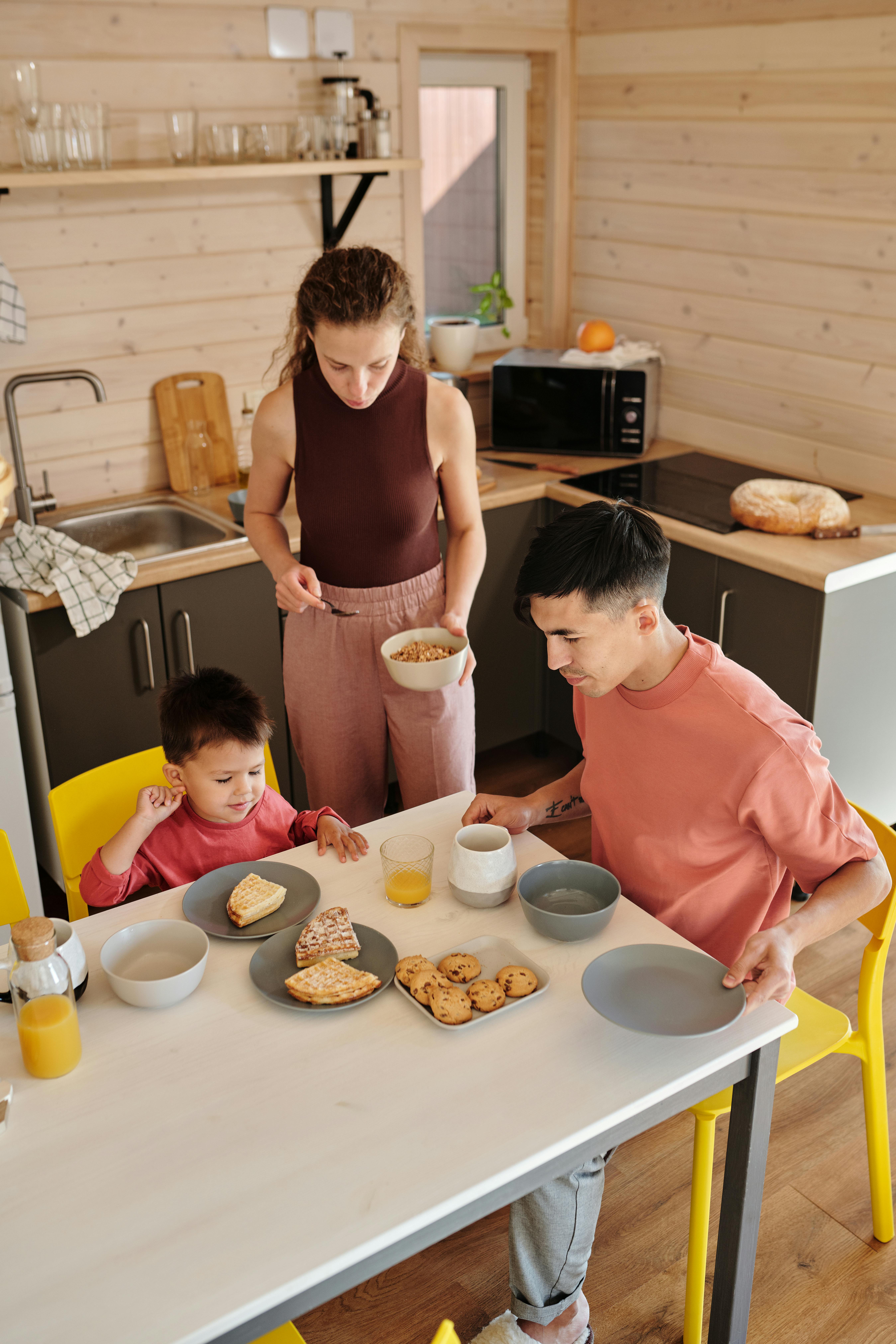 A Family Eating at the Table · Free Stock Photo