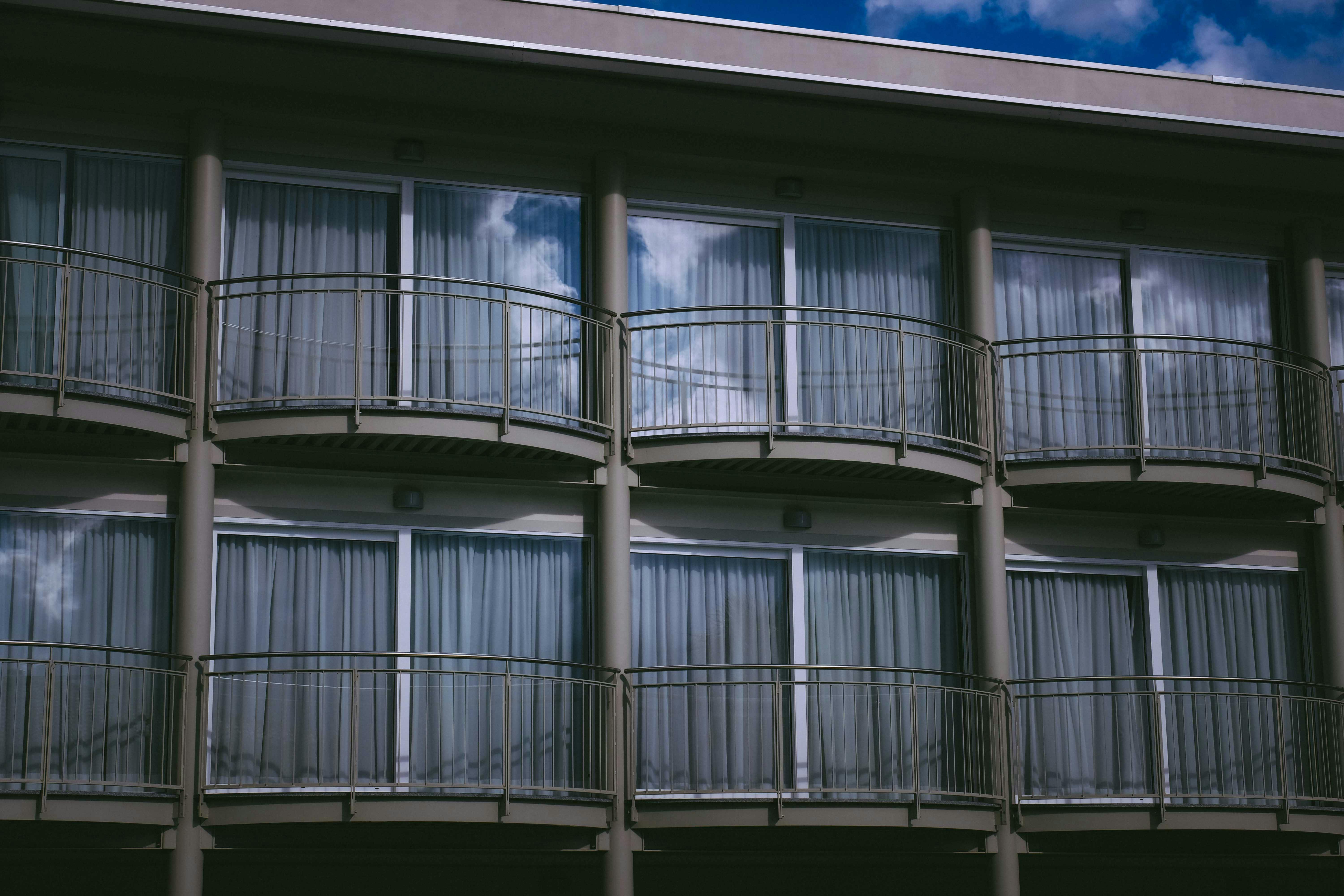 Exterior of building with windows and balconies · Free Stock Photo