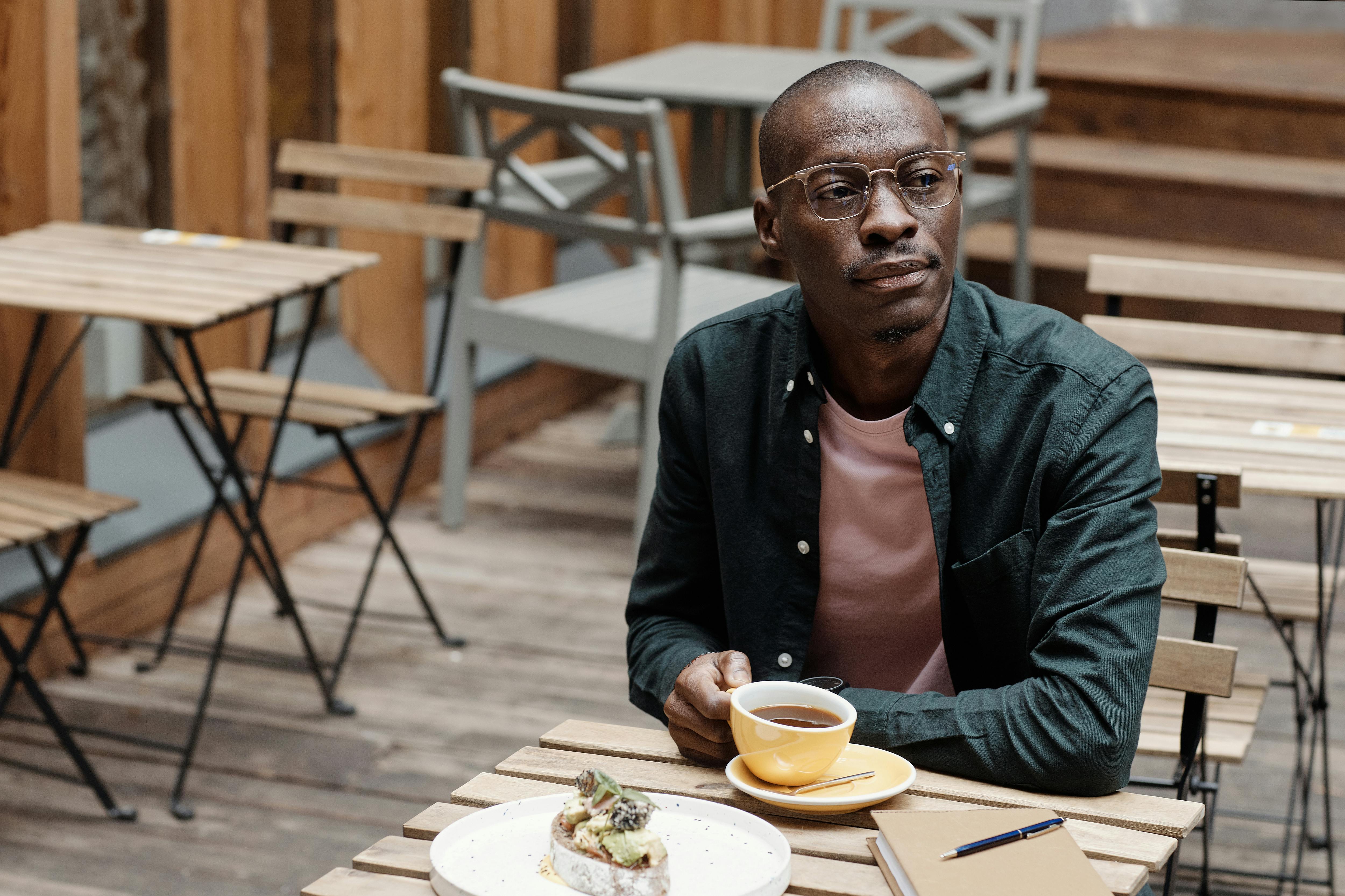 A Man Sitting at the Table · Free Stock Photo