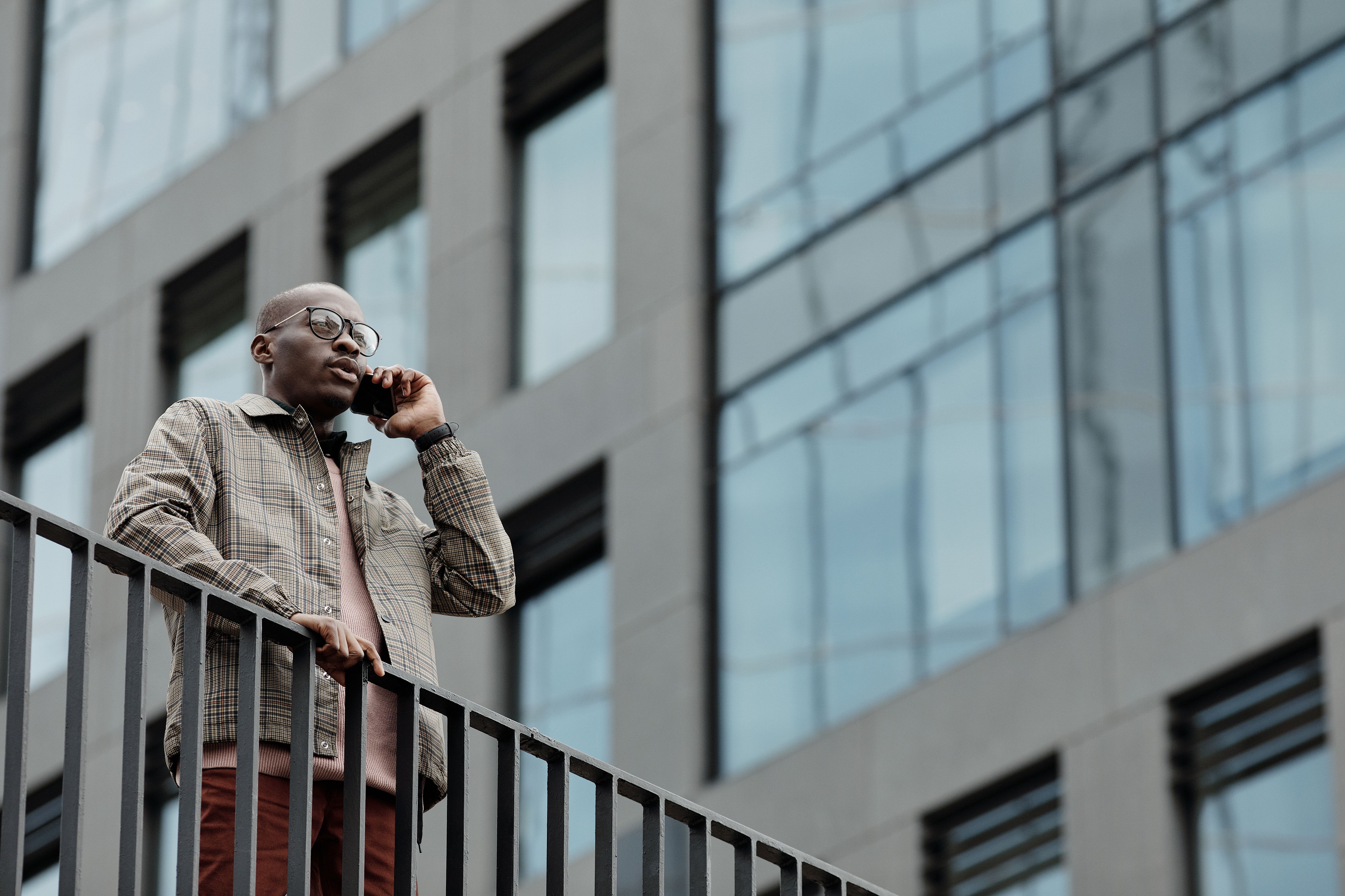 Man in Black Jacket Talking on the Phone · Free Stock Photo
