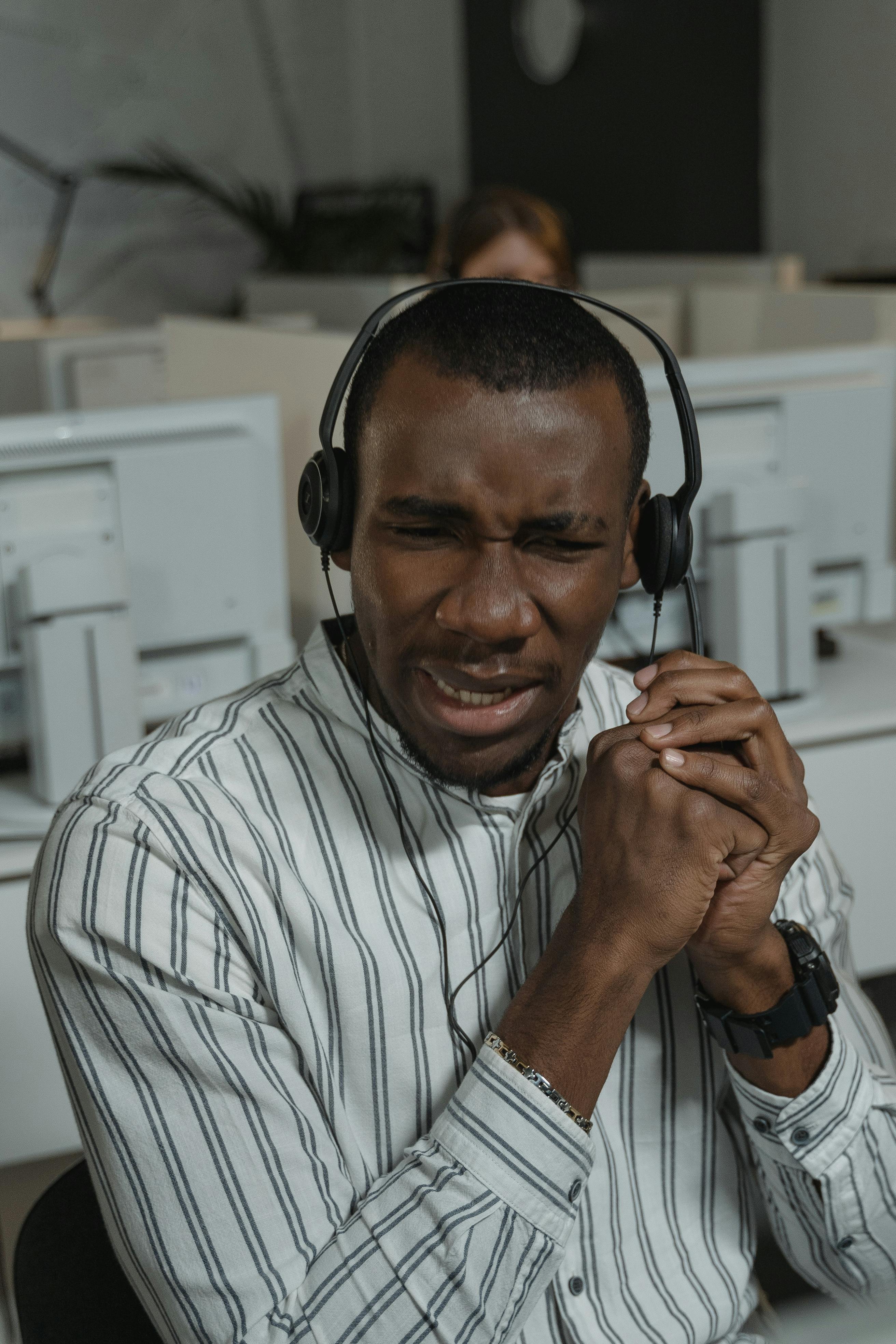 Close-up Photo of a Busy Call Center Agent · Free Stock Photo