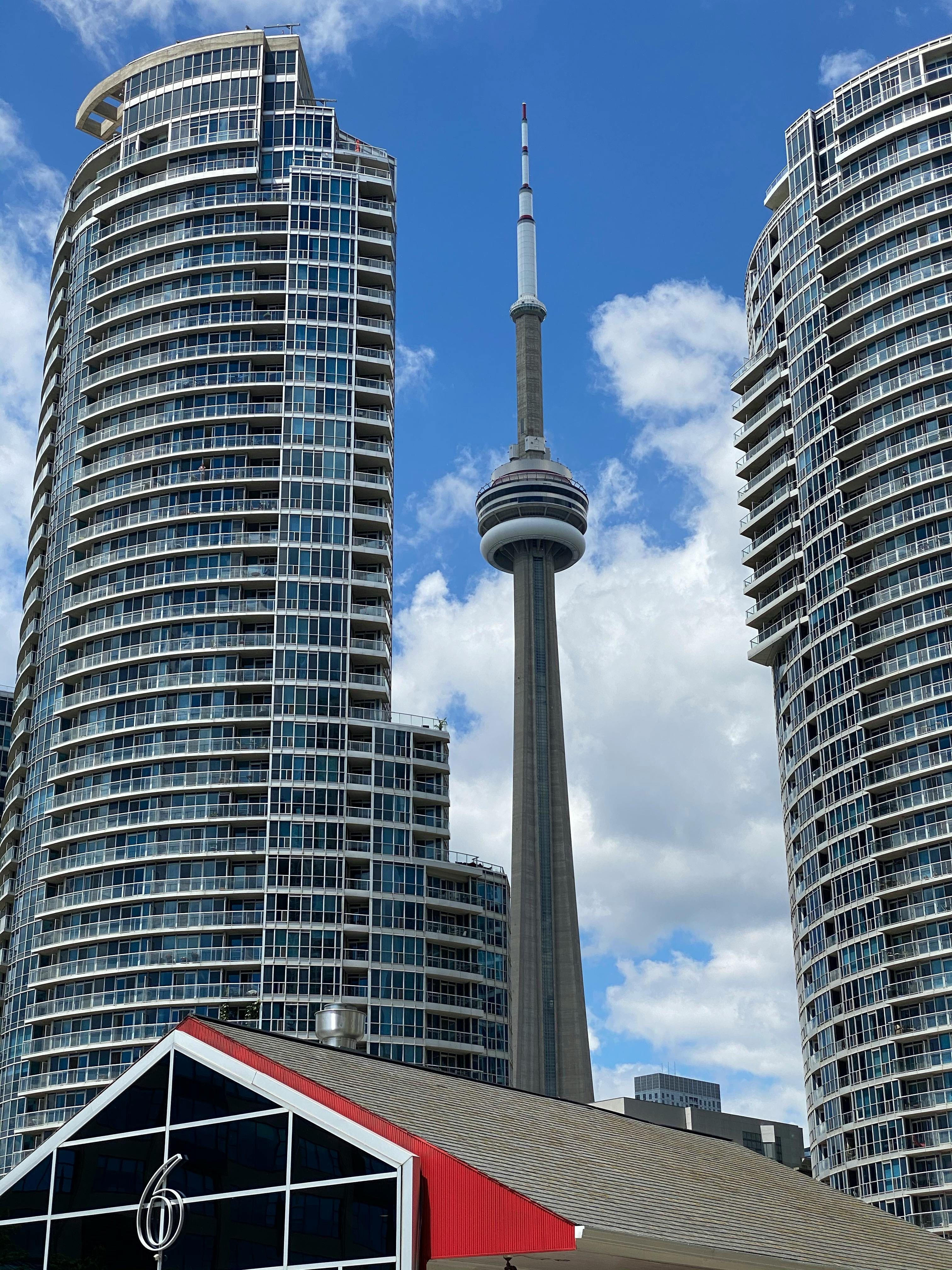 A Photo of Canadian National Tower Under Blue Sky · Free Stock Photo