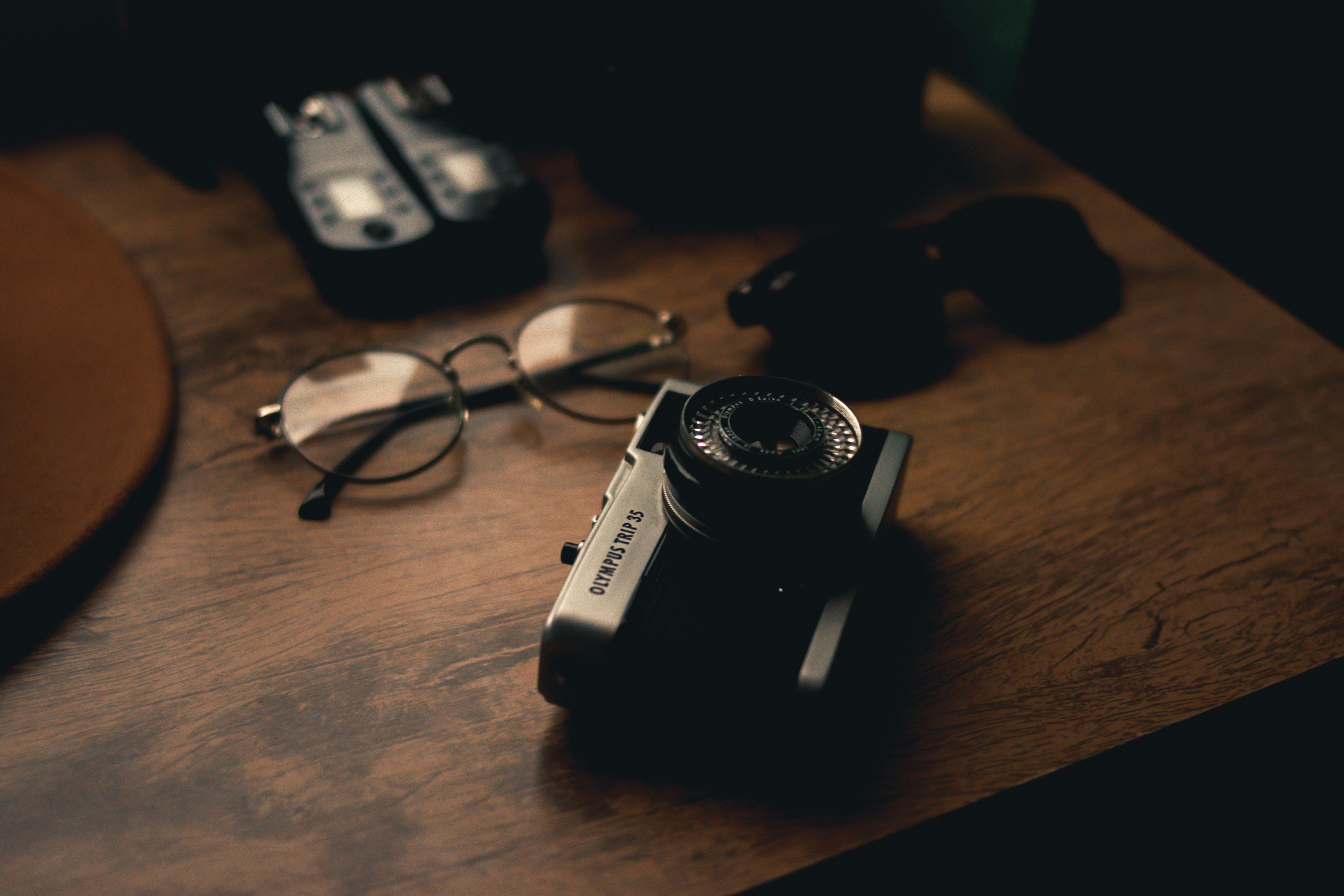 Old photo camera arranged on table with vintage chest and notepad ...