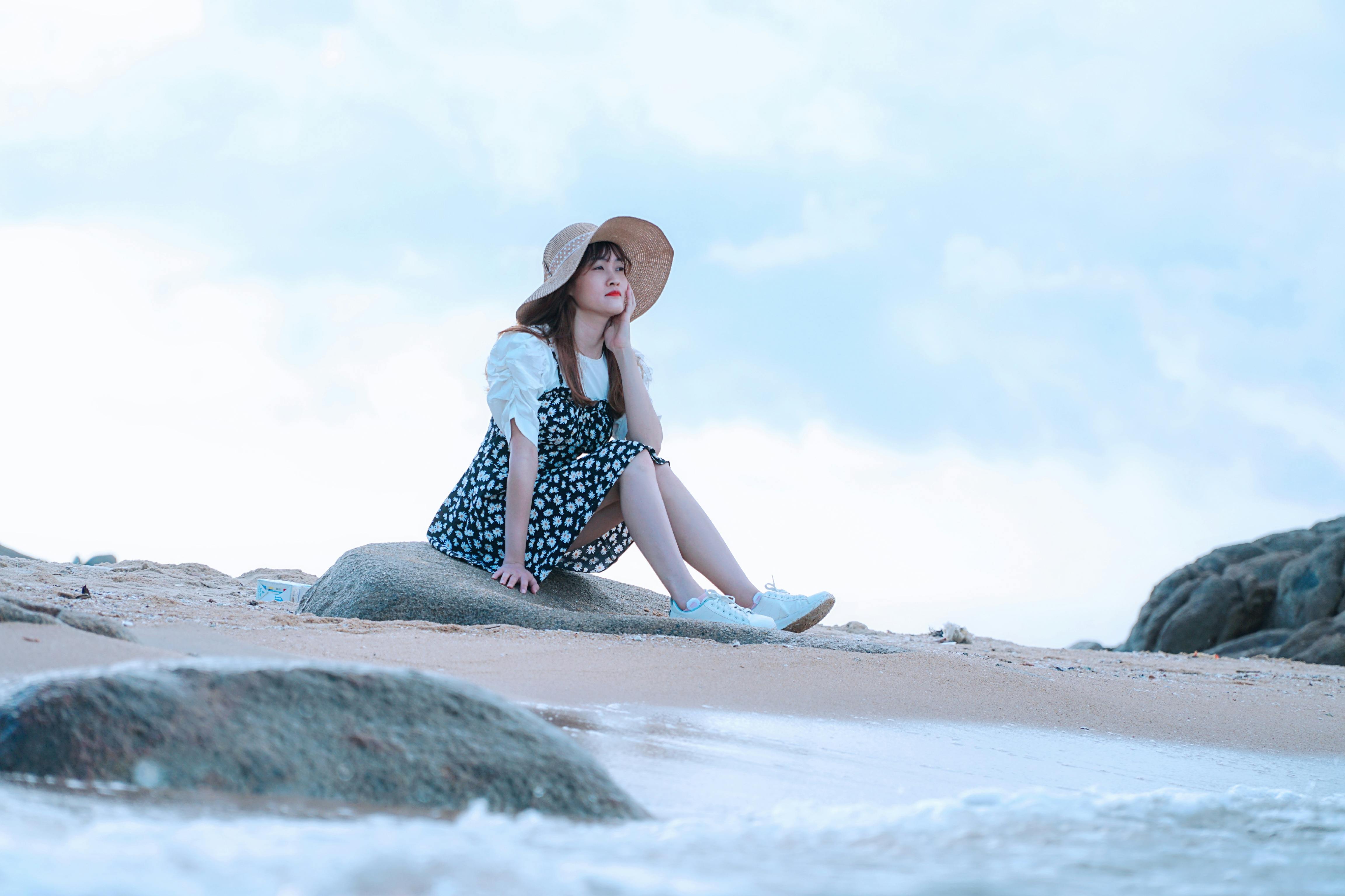 Woman in Bikini Posing on Rock at Beach · Free Stock Photo