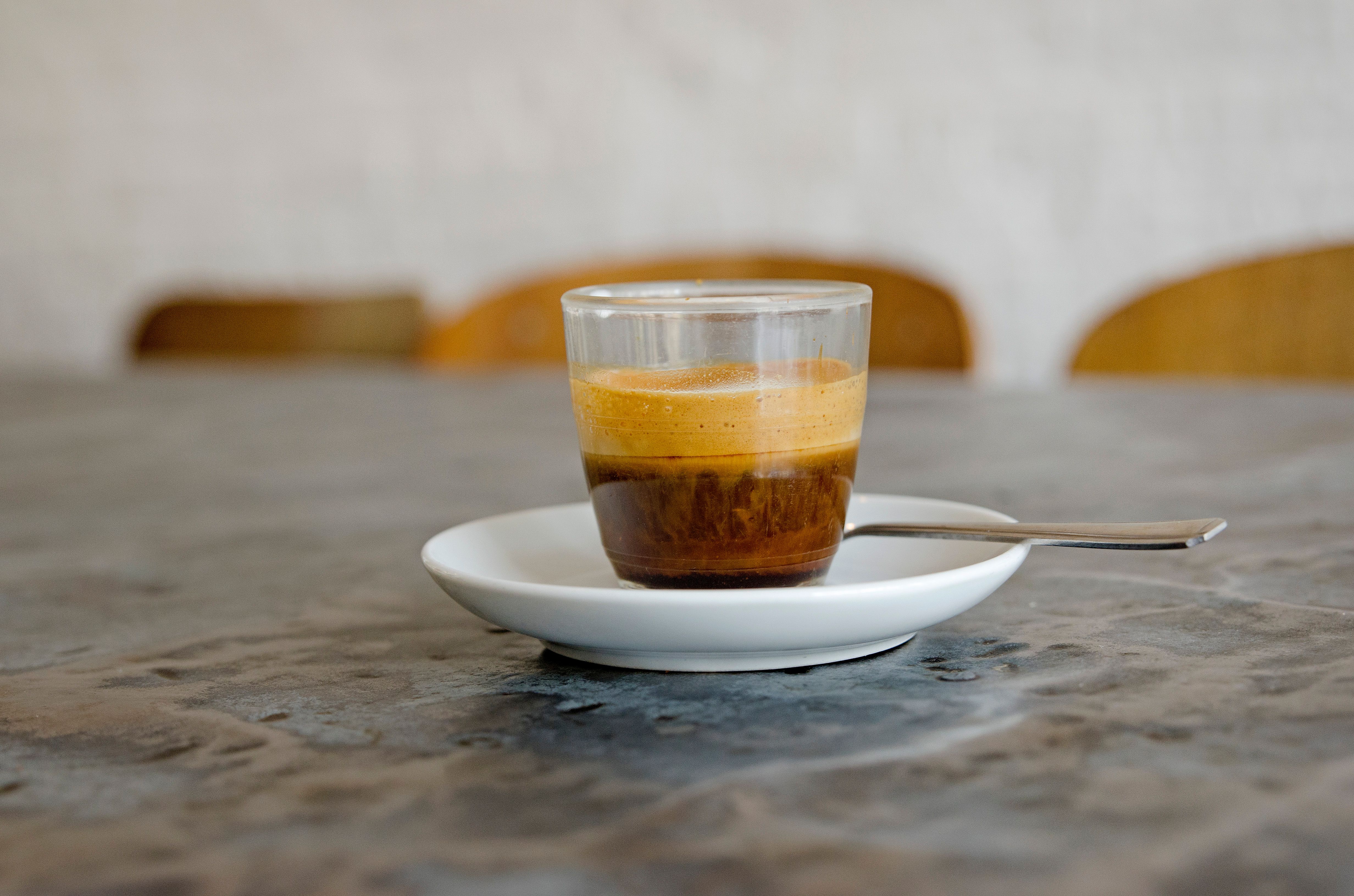 clear-drinking-glass-on-white-ceramic-saucer-free-stock-photo