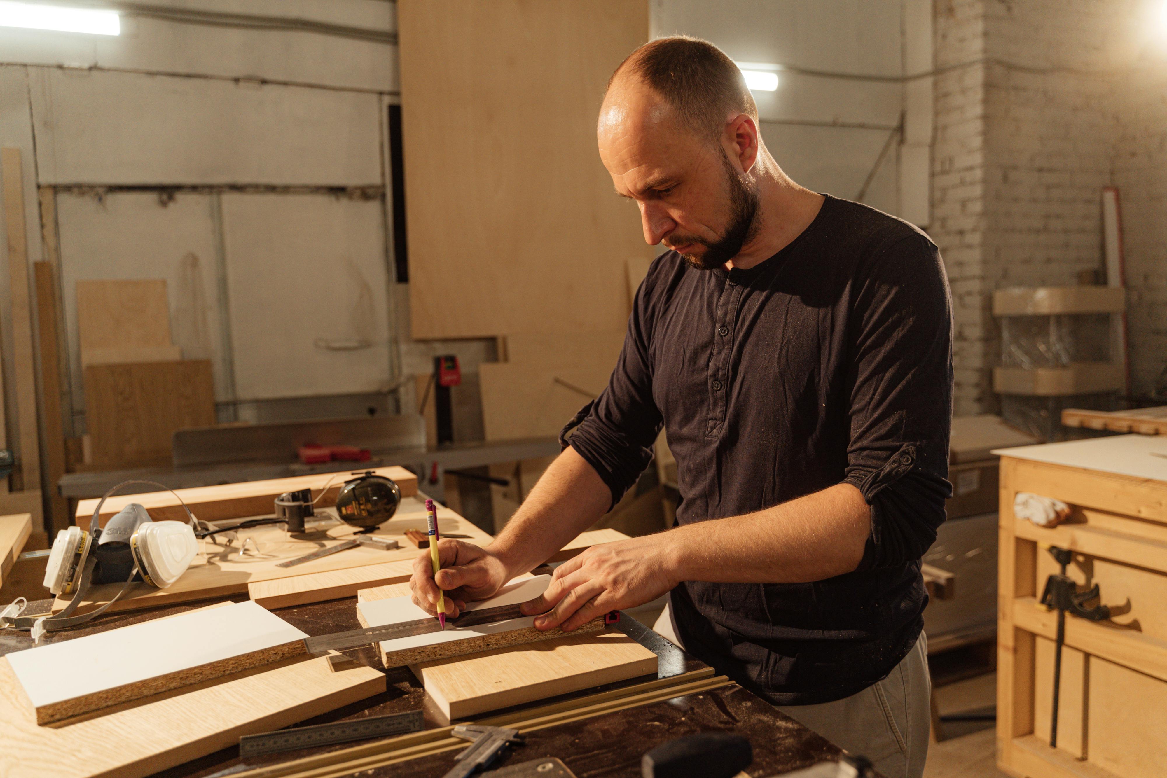 Man Holding Chisel and Mallet · Free Stock Photo