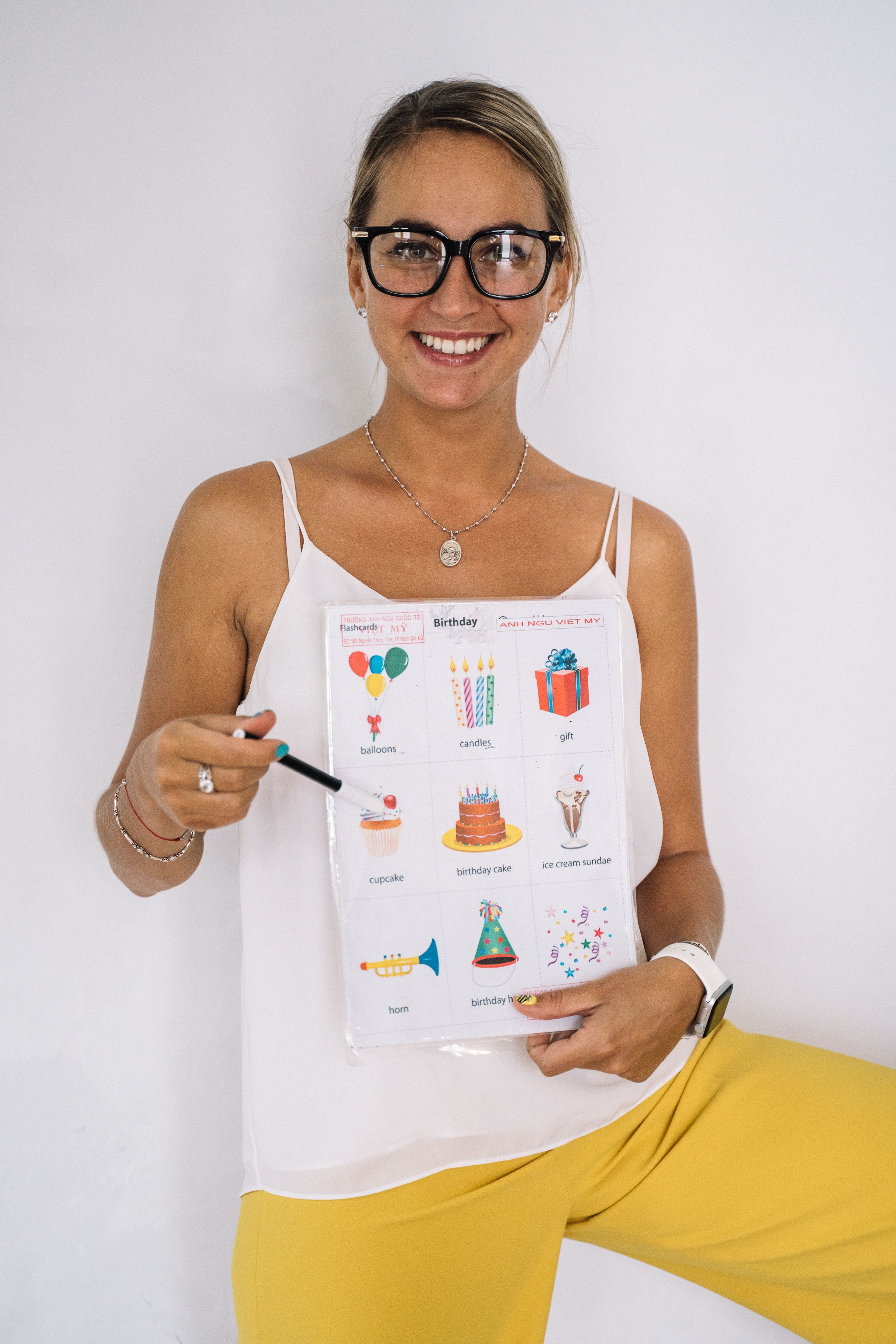 Teacher holding Learning Materials · Free Stock Photo