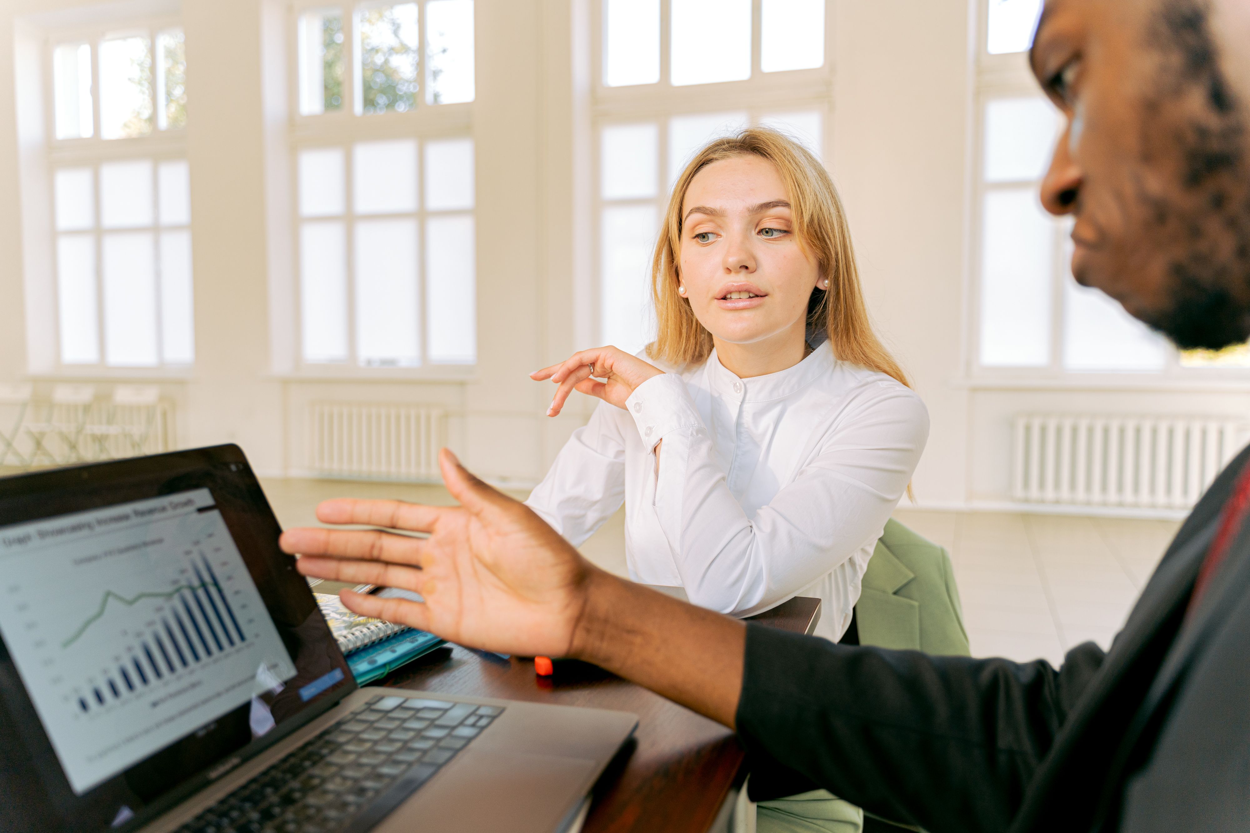 Officemates Looking at the laptop · Free Stock Photo