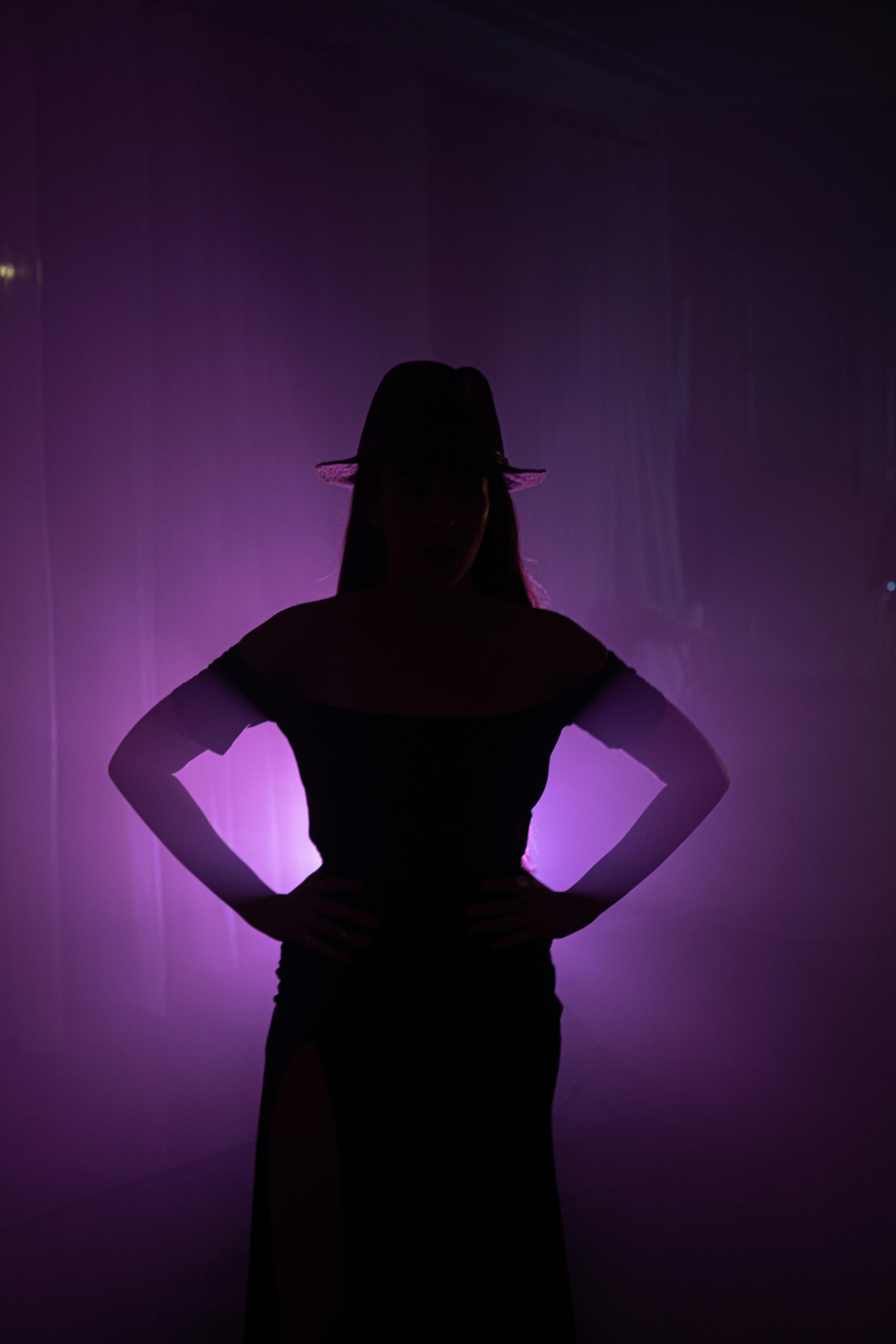 Woman Standing in Shadow · Free Stock Photo