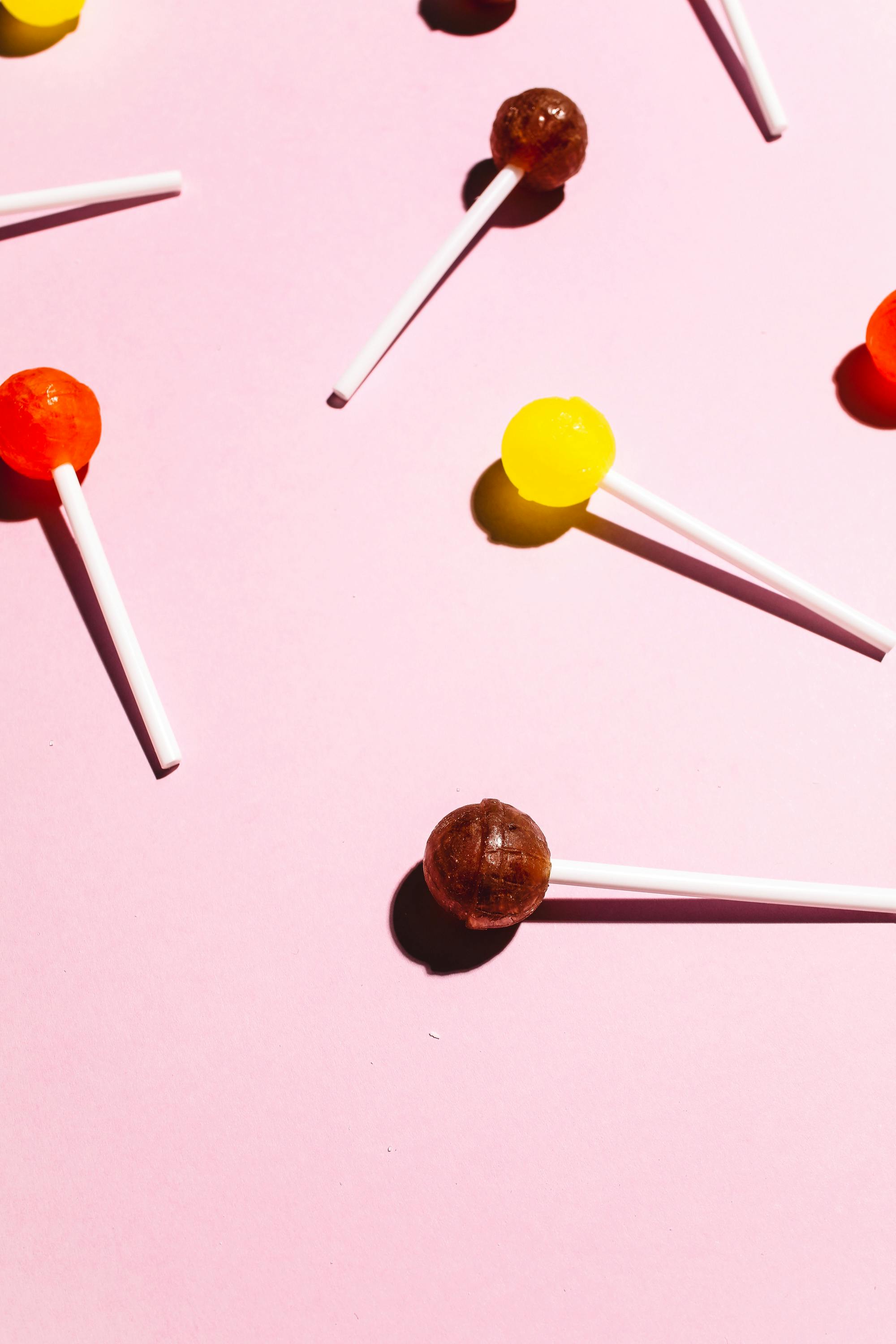 Lollipops on Light Pink Background · Free Stock Photo