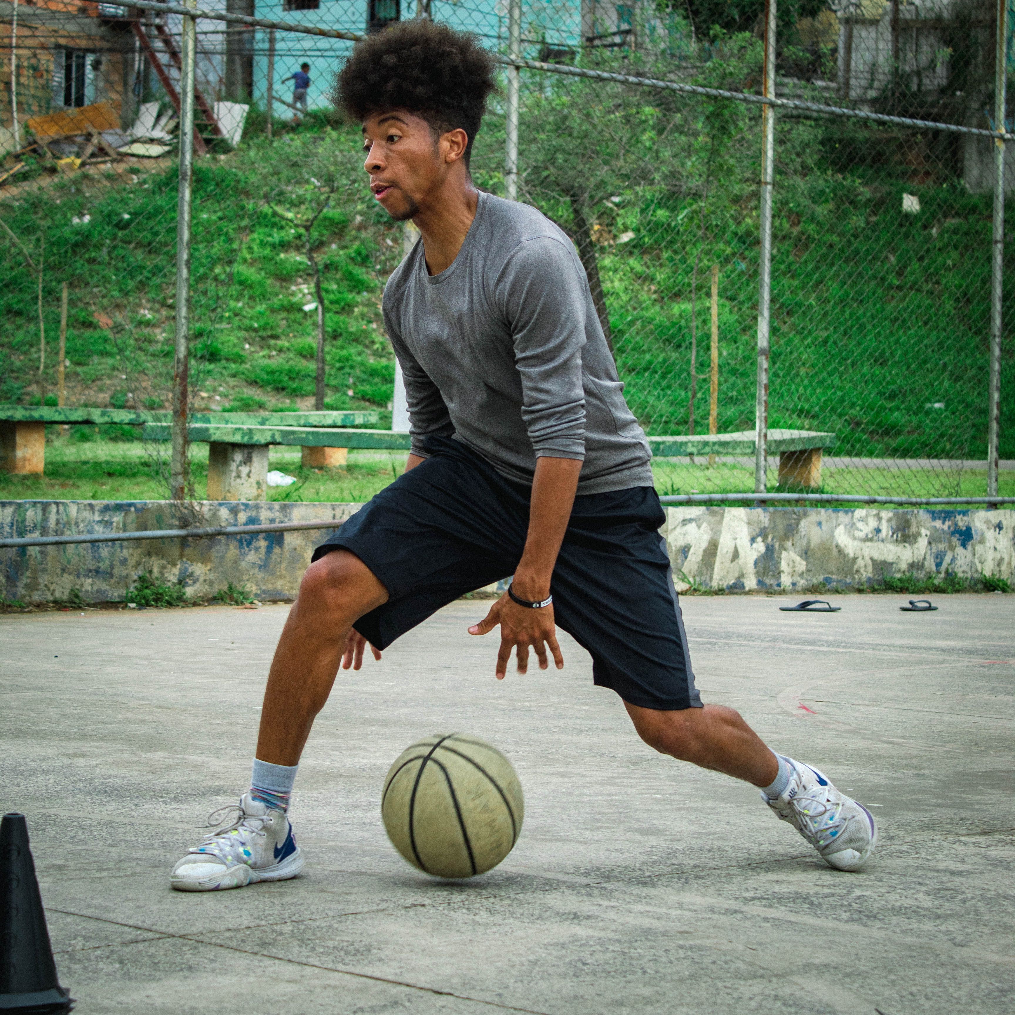Man in Gray Long Sleeve Shirt Dribbling The Ball With Skill · Free ...