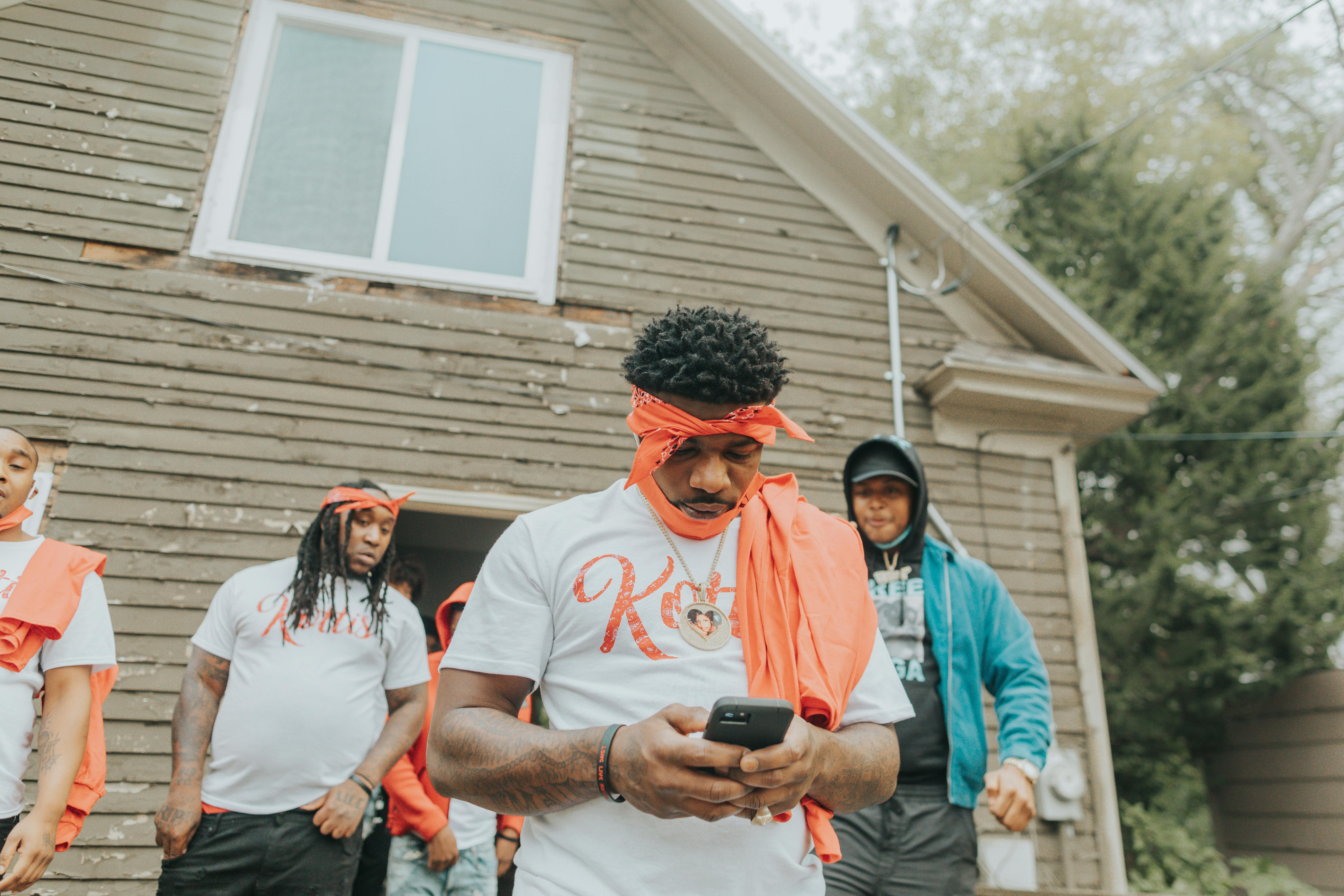 Group of Men Standing Outside the House · Free Stock Photo