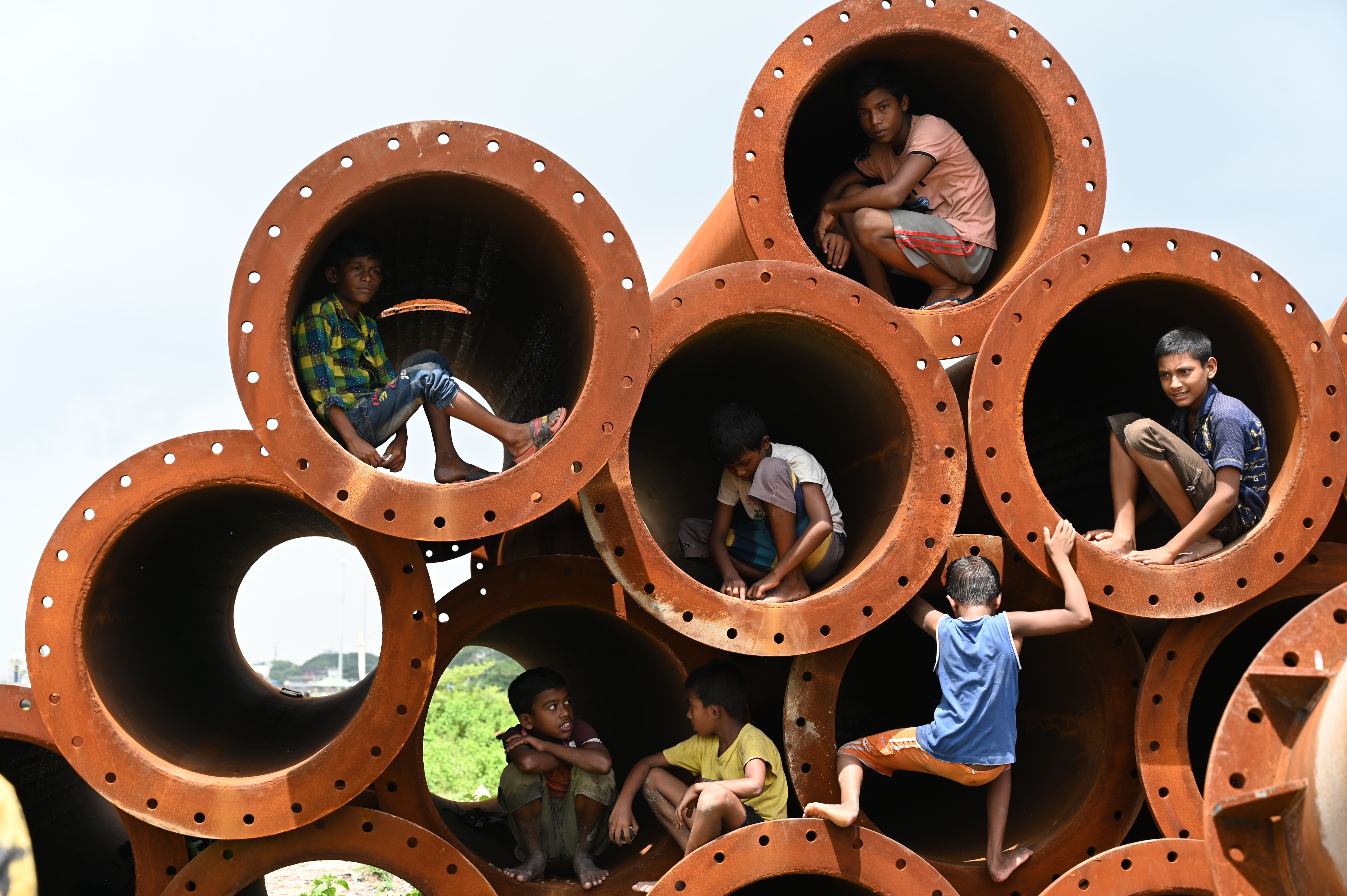 Boys Playing in Pipes · Free Stock Photo