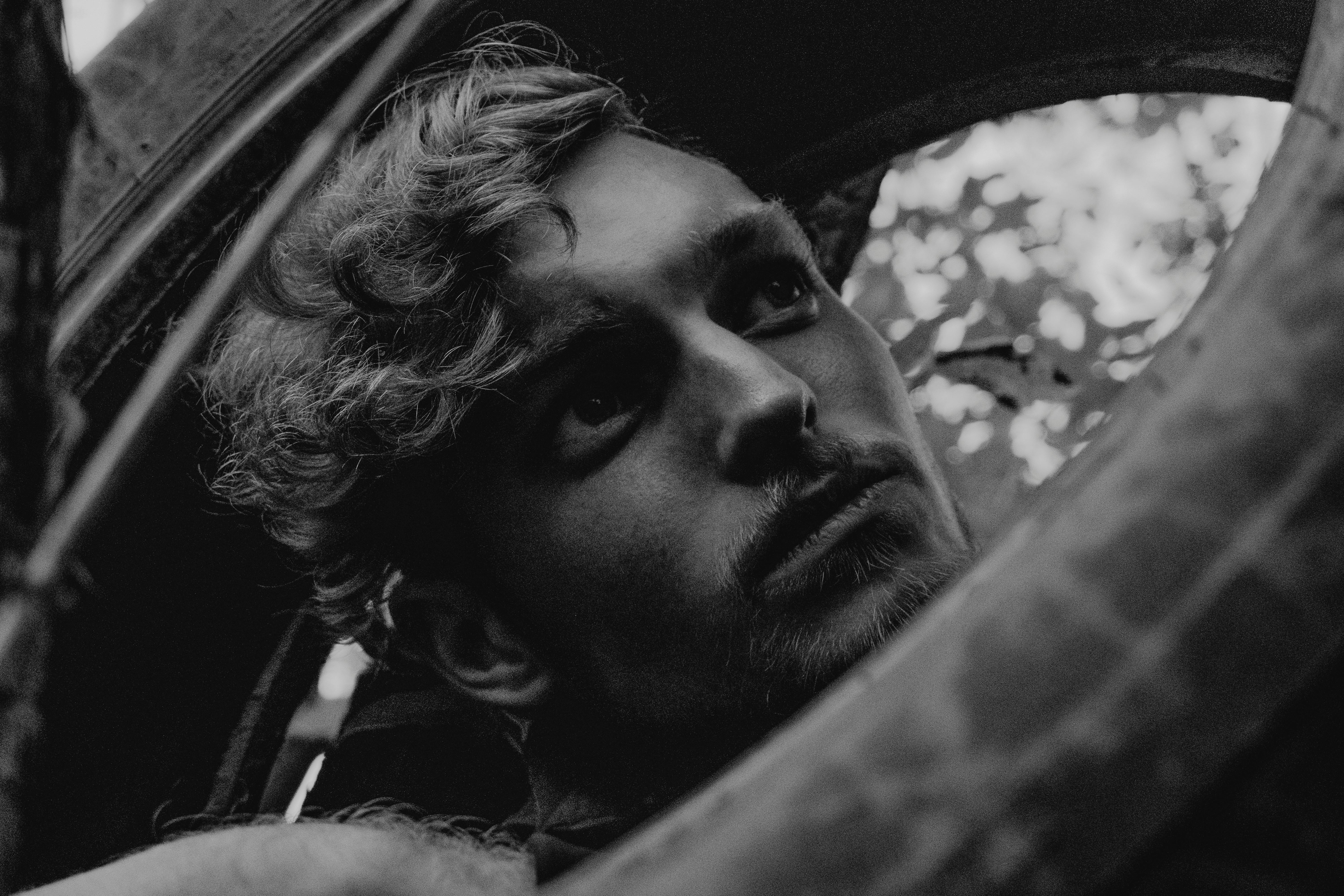 Grayscale Photography of a Man Looking Afar · Free Stock Photo