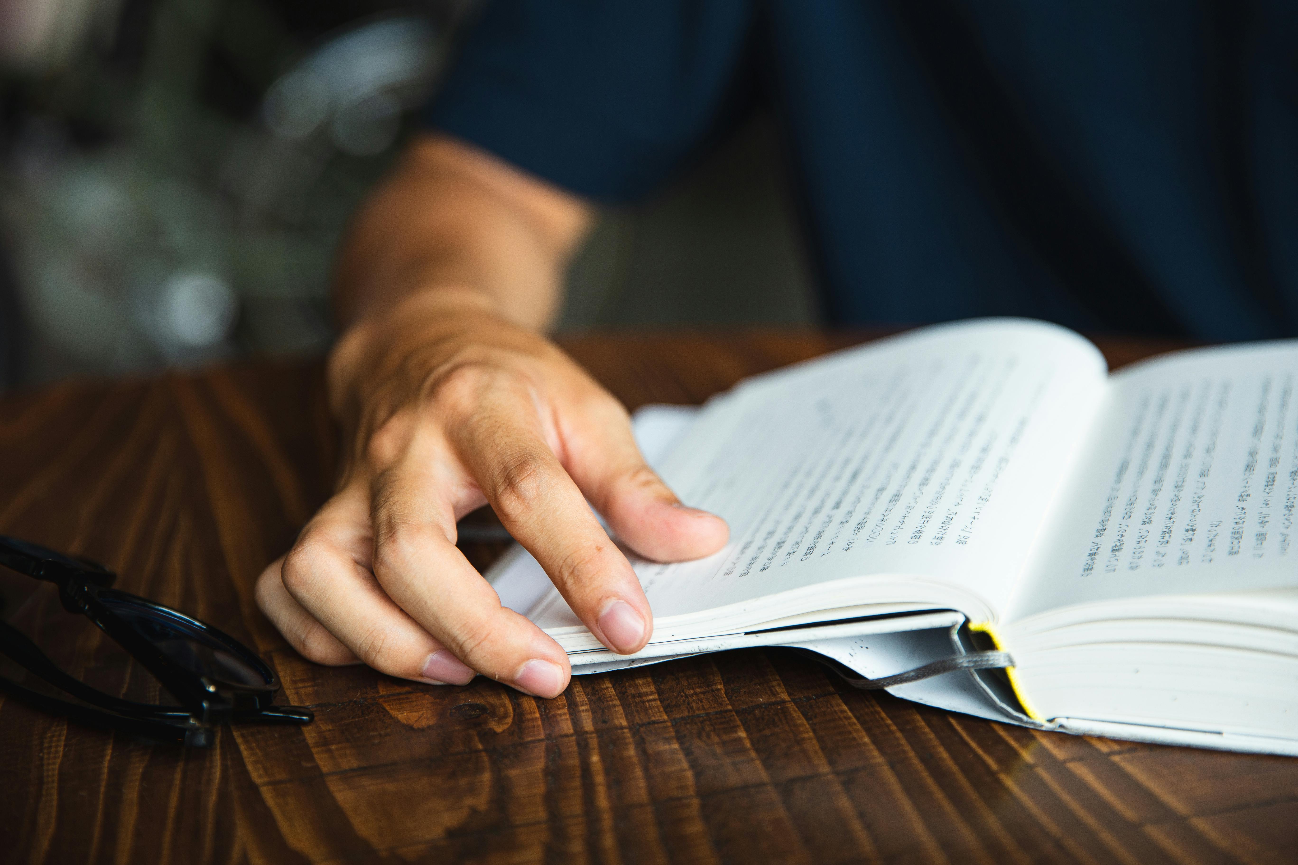 Woman holding book with blank pages · Free Stock Photo