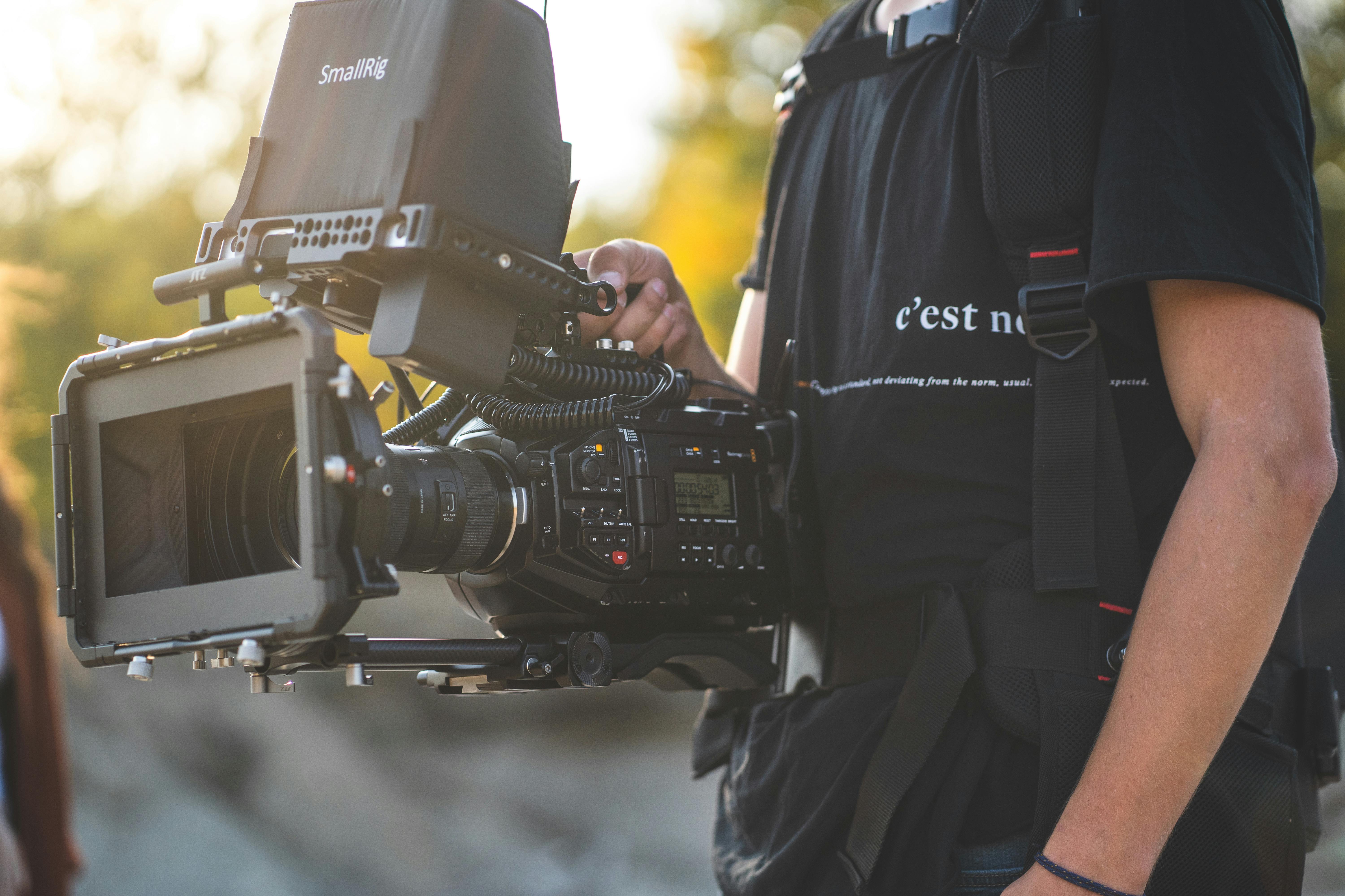 Person Standing While Holding Camera · Free Stock Photo
