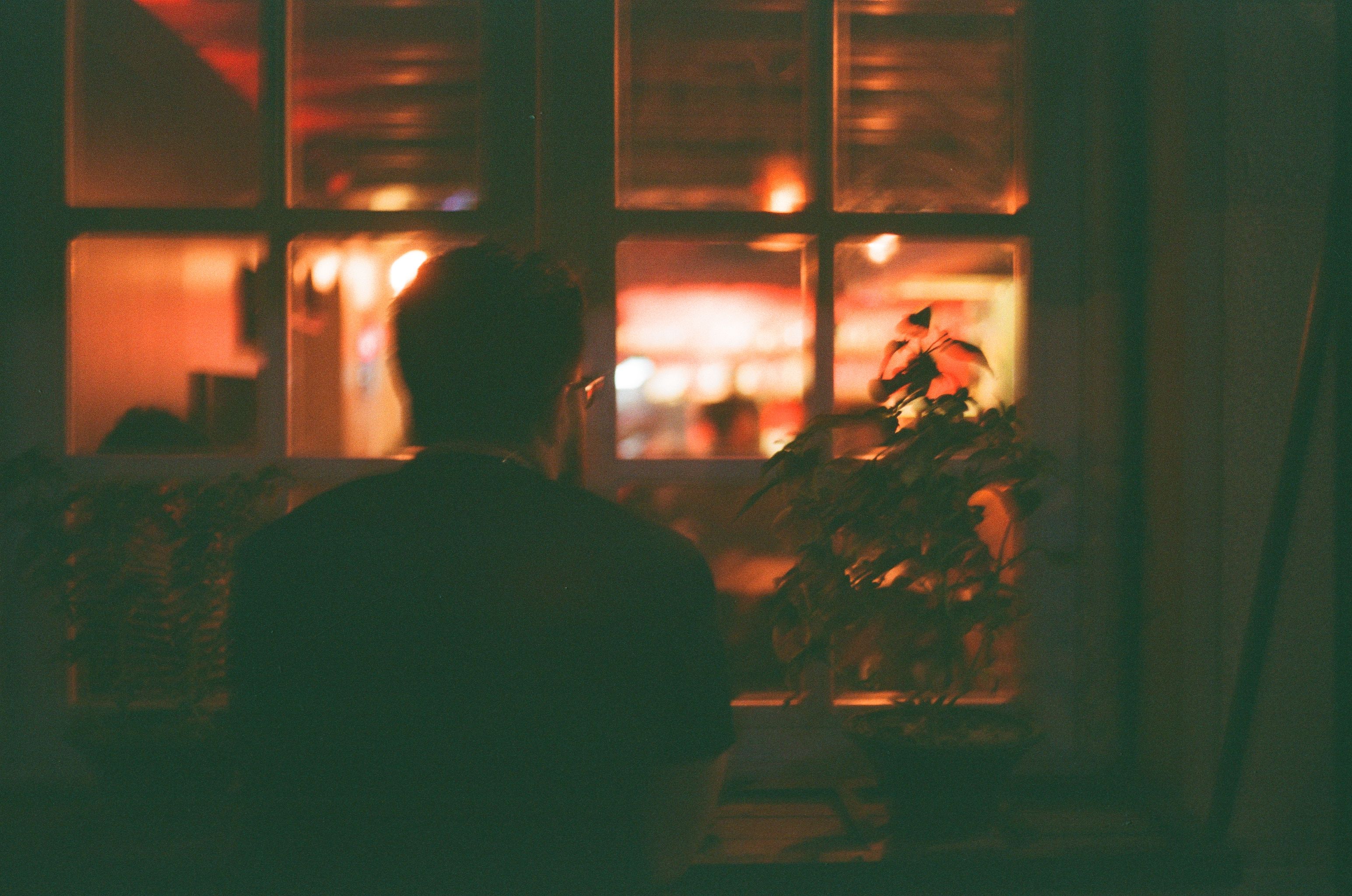 Two People Standing behind the Glass · Free Stock Photo
