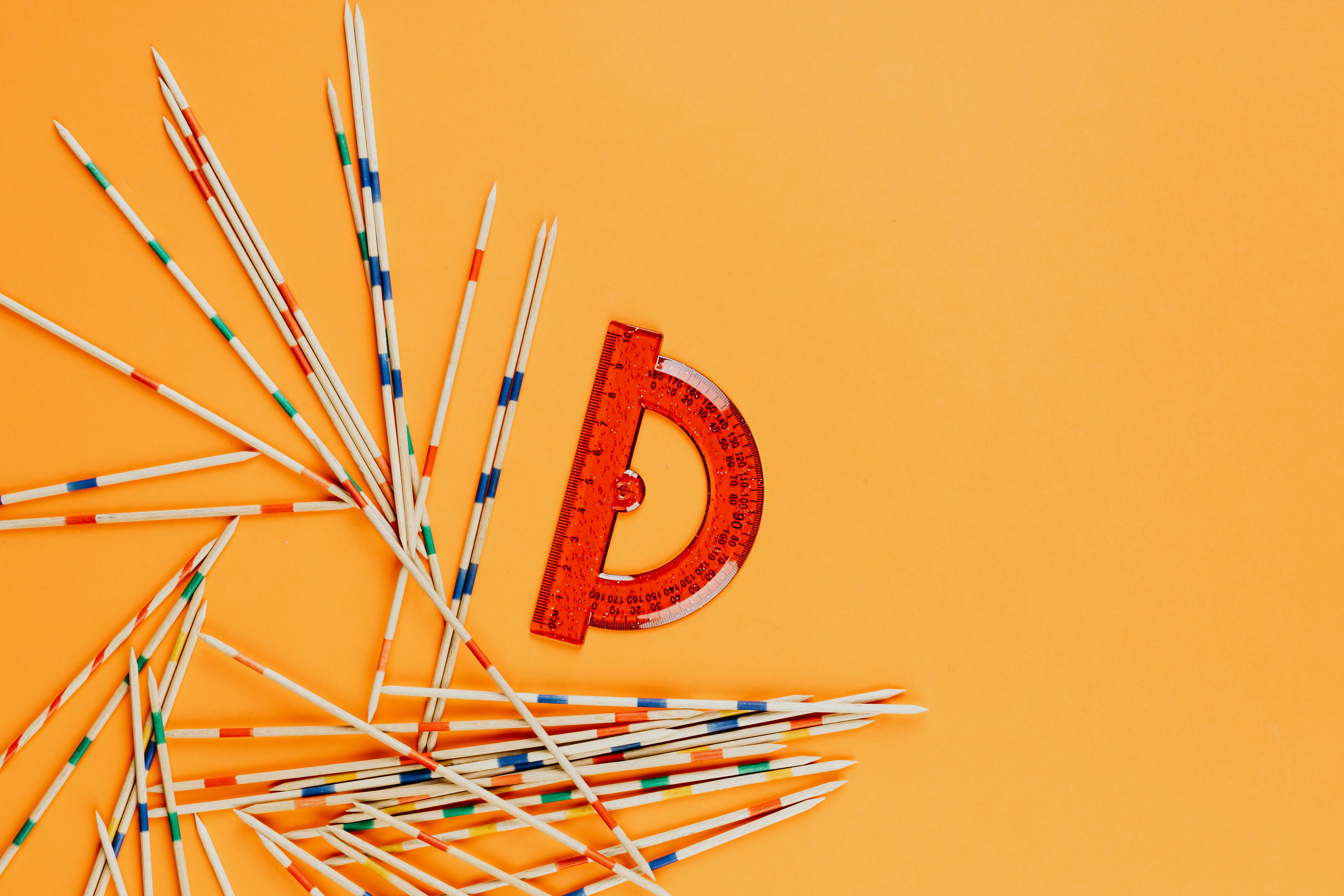 Wooden Sticks Beside a Protractor · Free Stock Photo