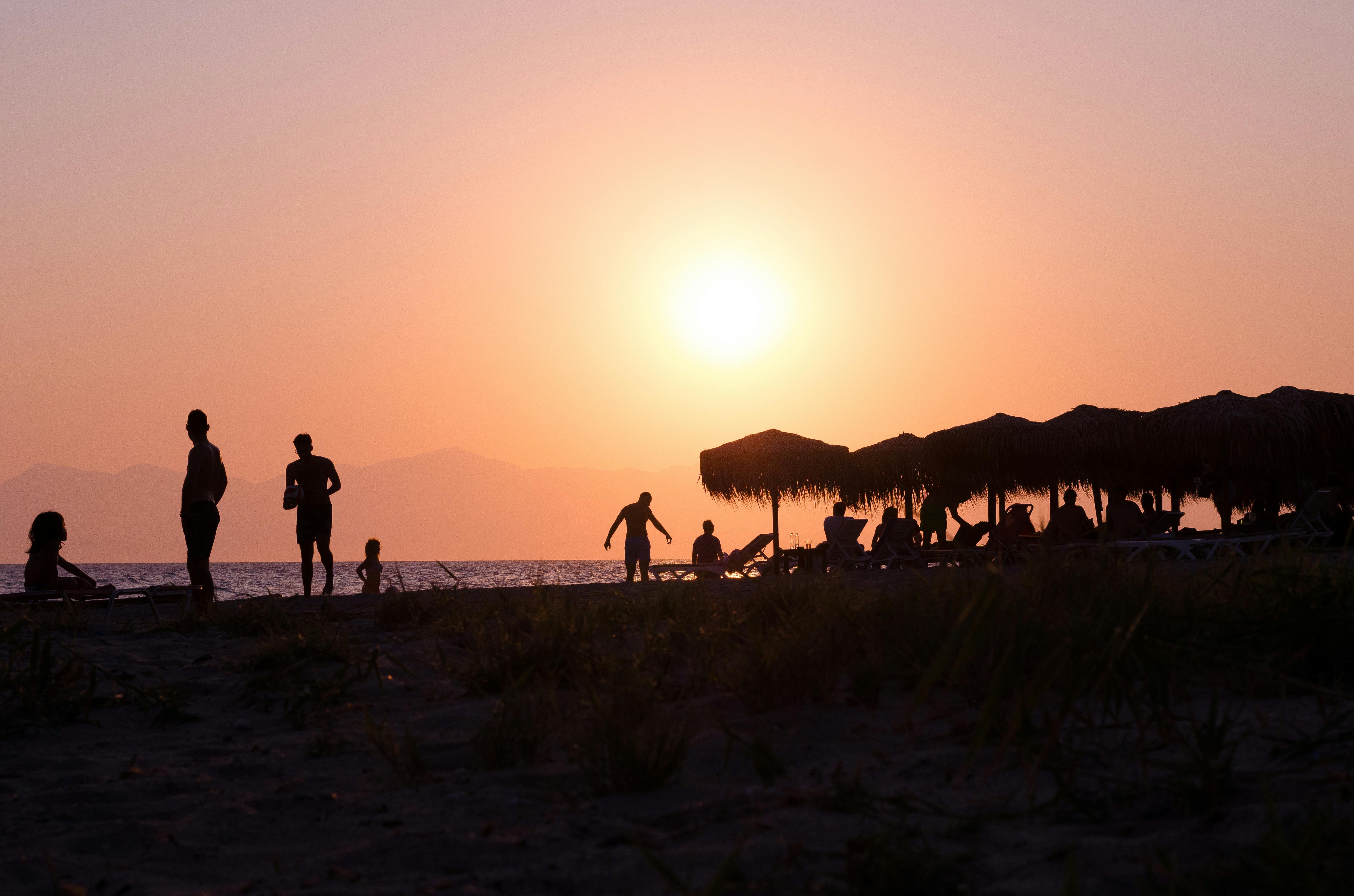 People Enjoying the Day on the Beach · Free Stock Photo