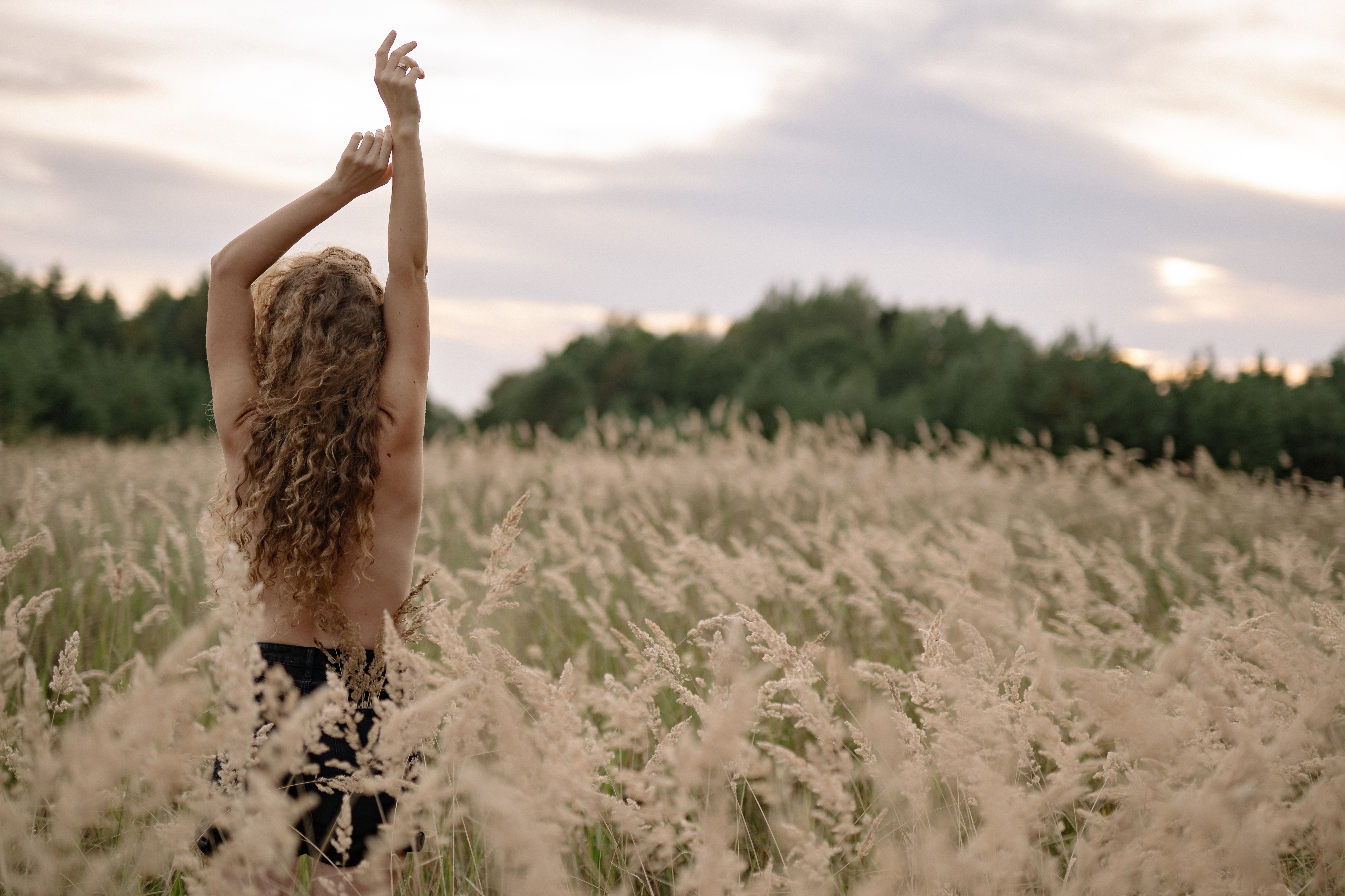 Woman Standing Throwing Her Head Back · Free Stock Photo