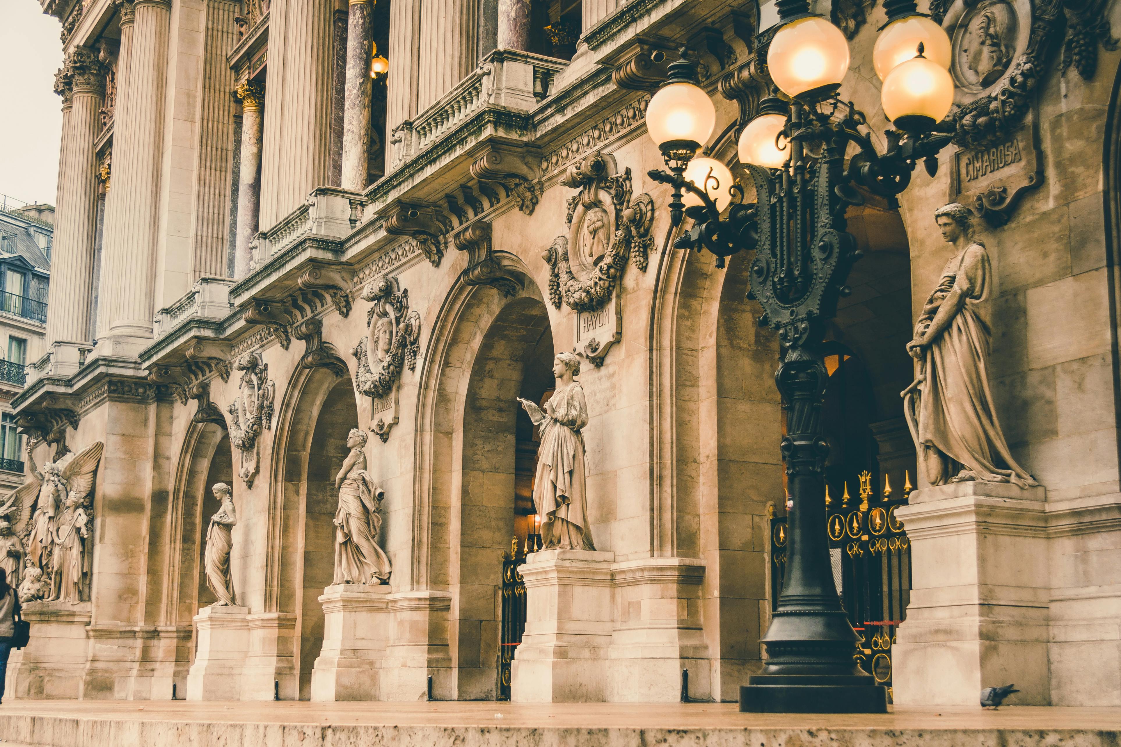Monuments on Pillars and Black Lamp Post · Free Stock Photo