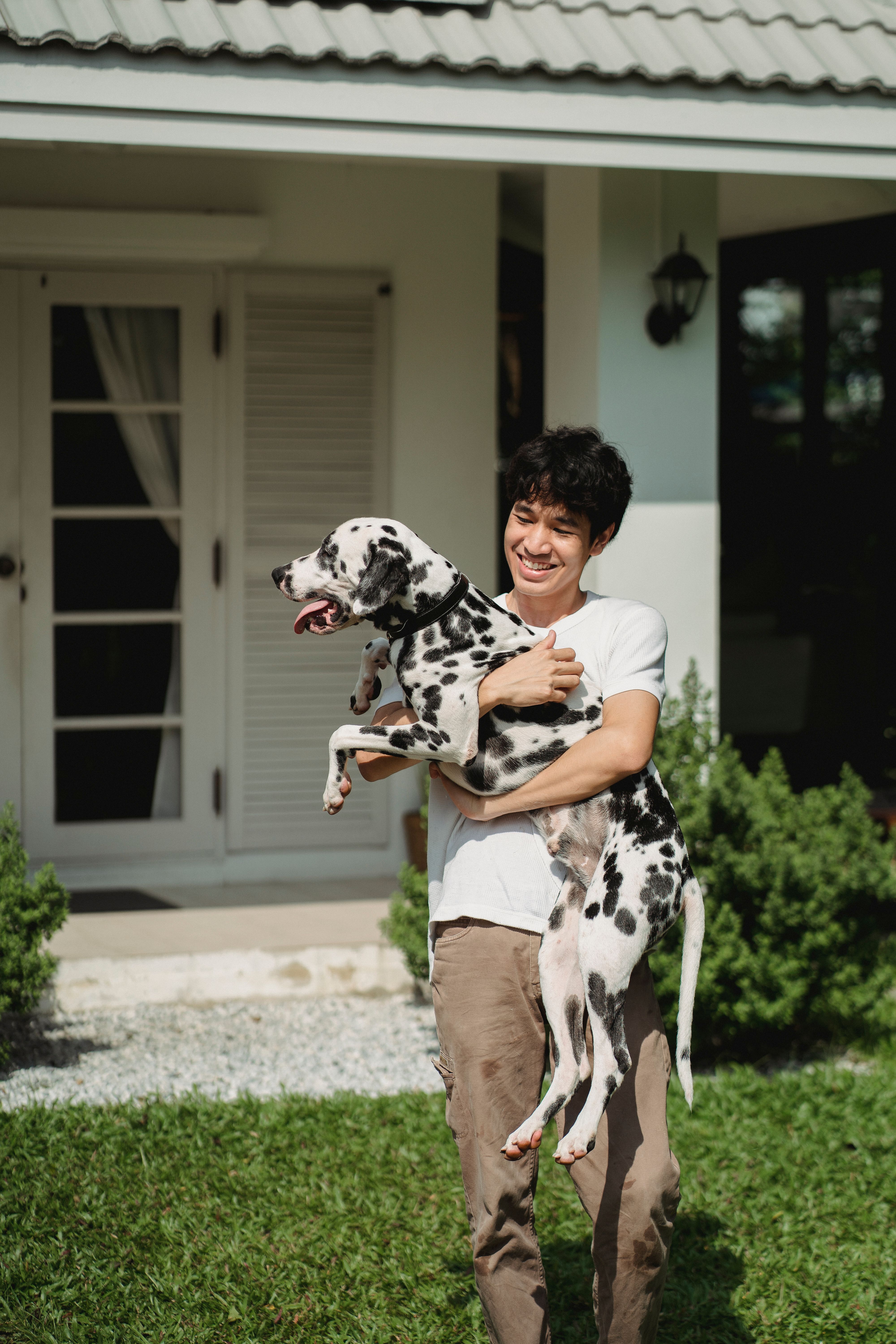 A Man Carrying His Pet Dog · Free Stock Photo