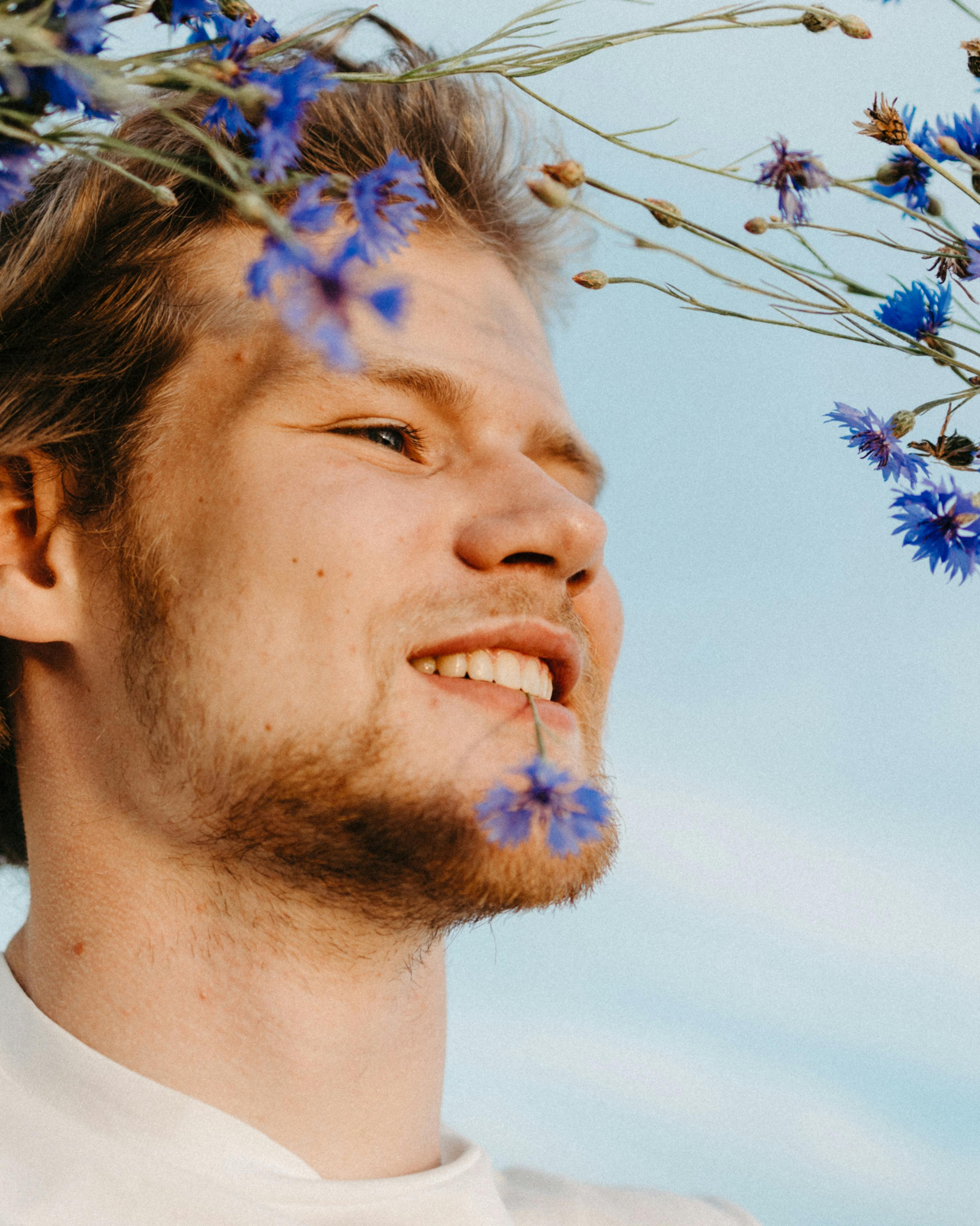 Man Biting a Flower · Free Stock Photo