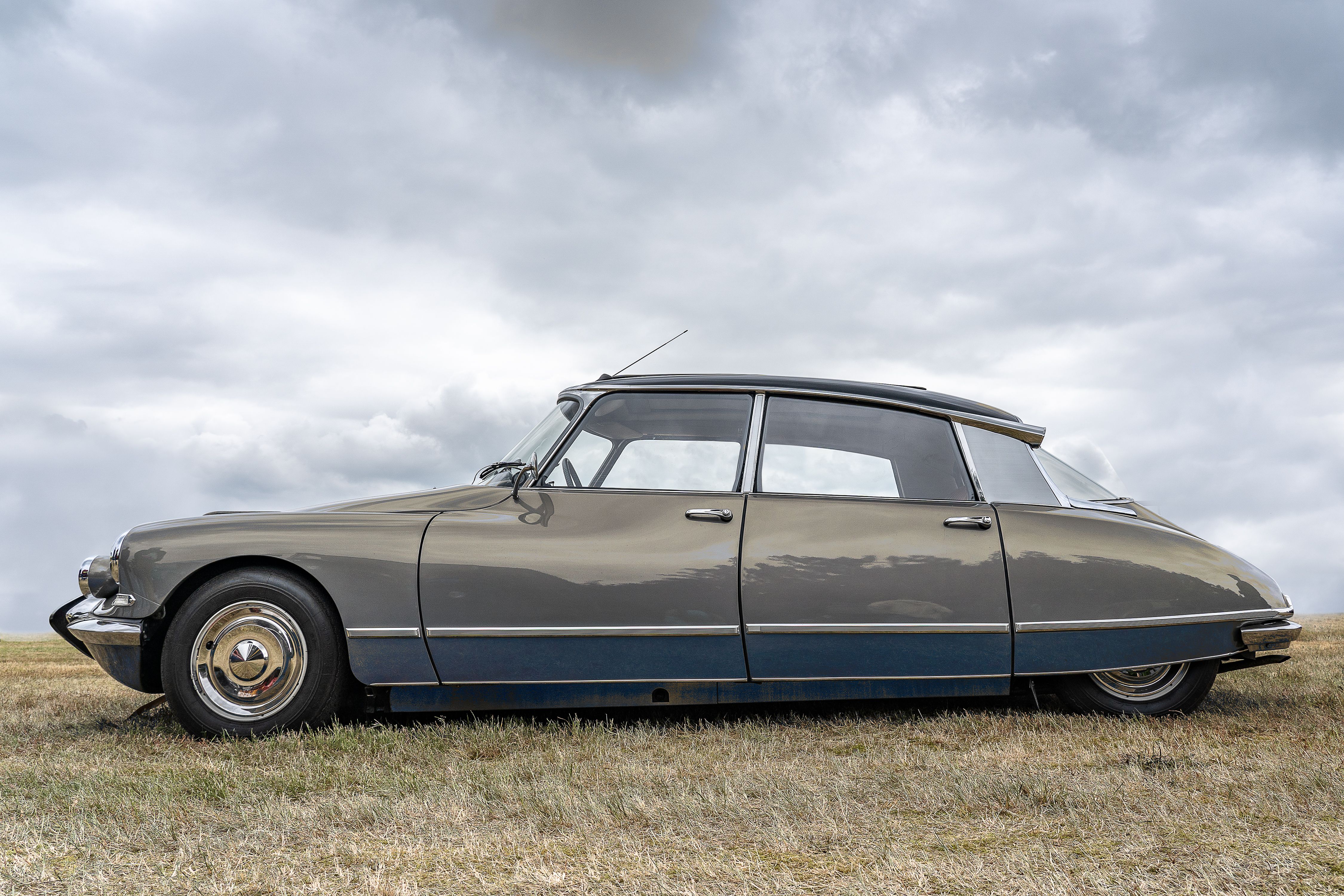 Car on Green Grass Field Under White Clouds · Free Stock Photo