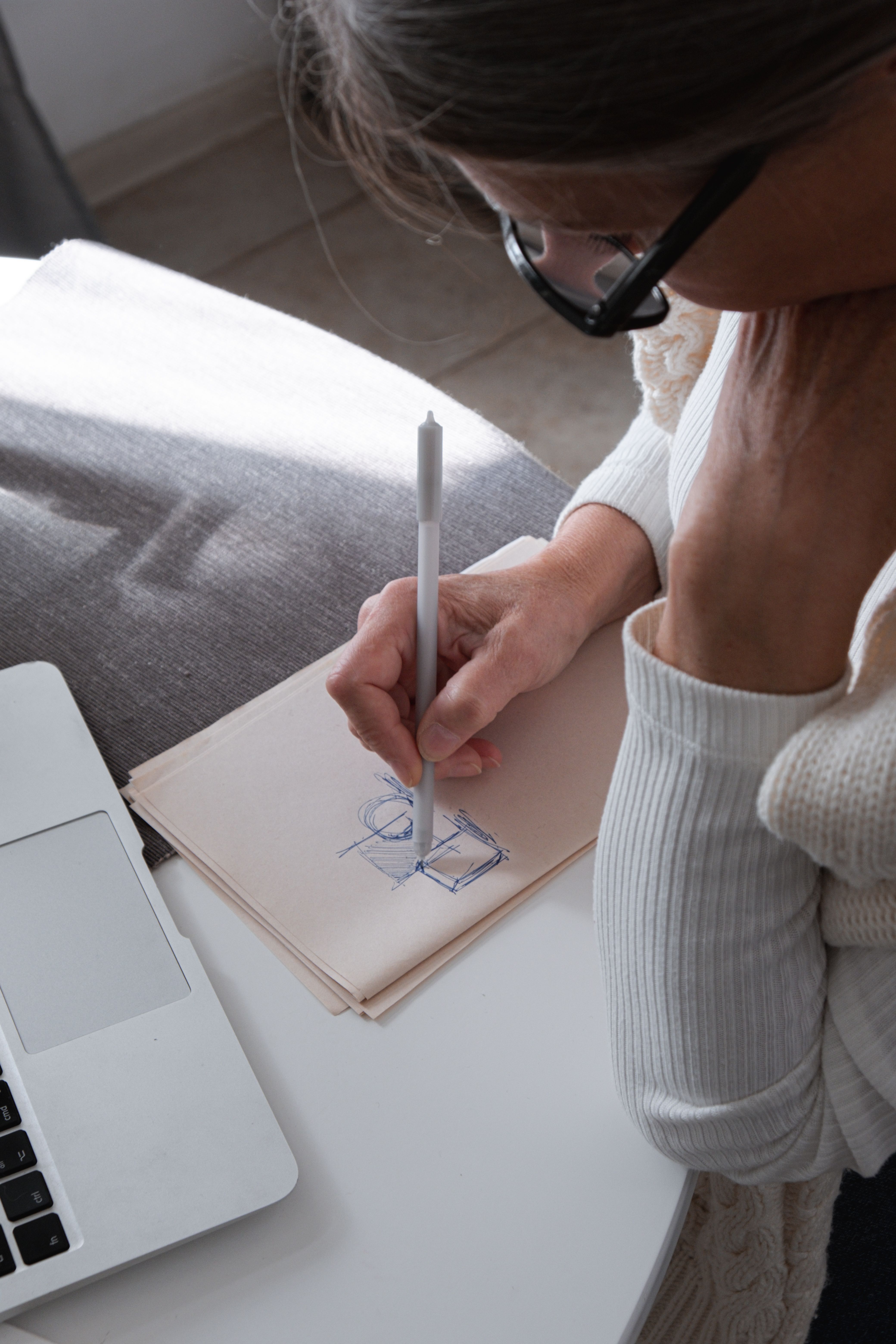 A Woman Drawing on Notebook · Free Stock Photo