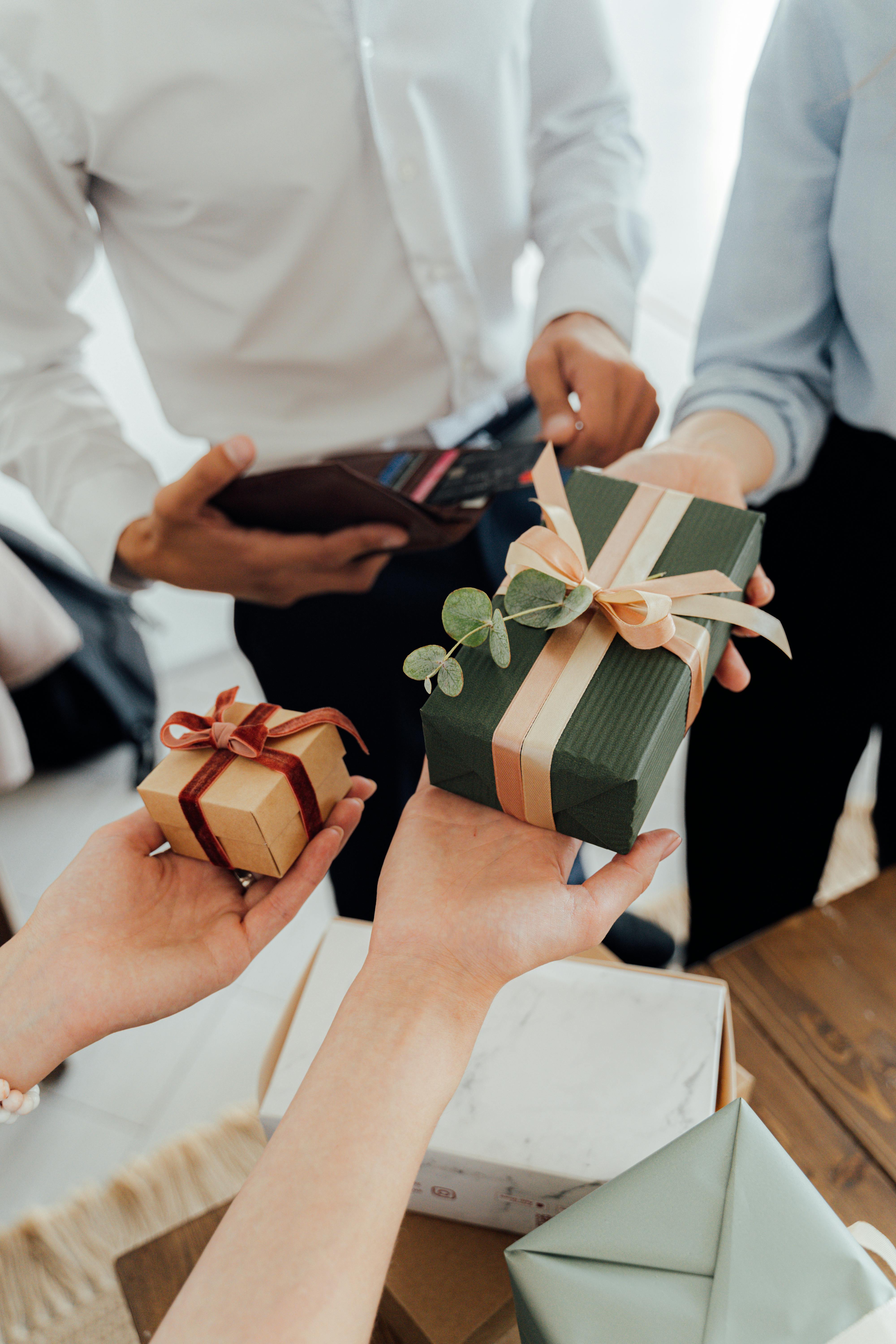 A Person Holding Green and Brown Gift Box · Free Stock Photo