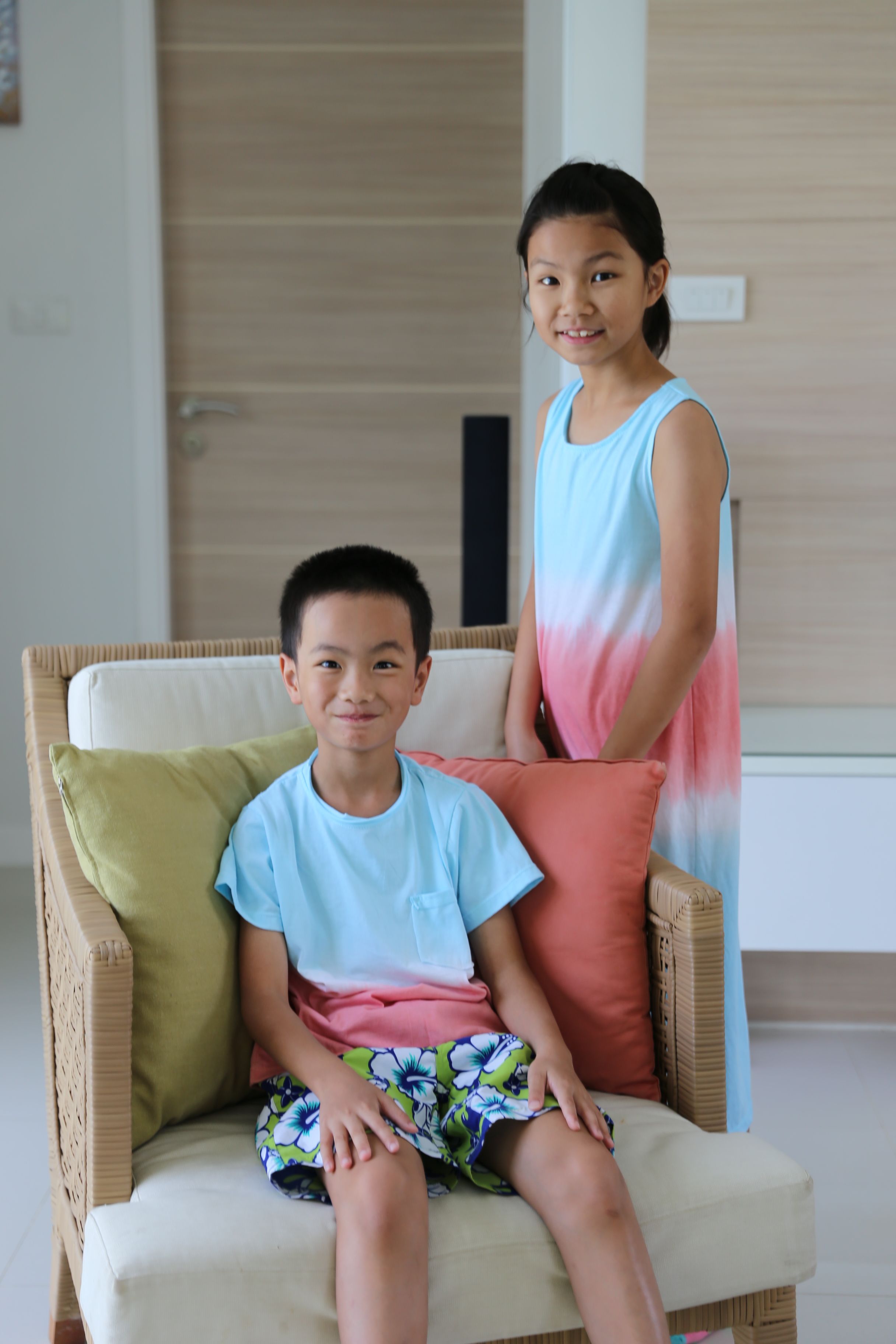 Happy black siblings sitting on cozy armchair · Free Stock Photo