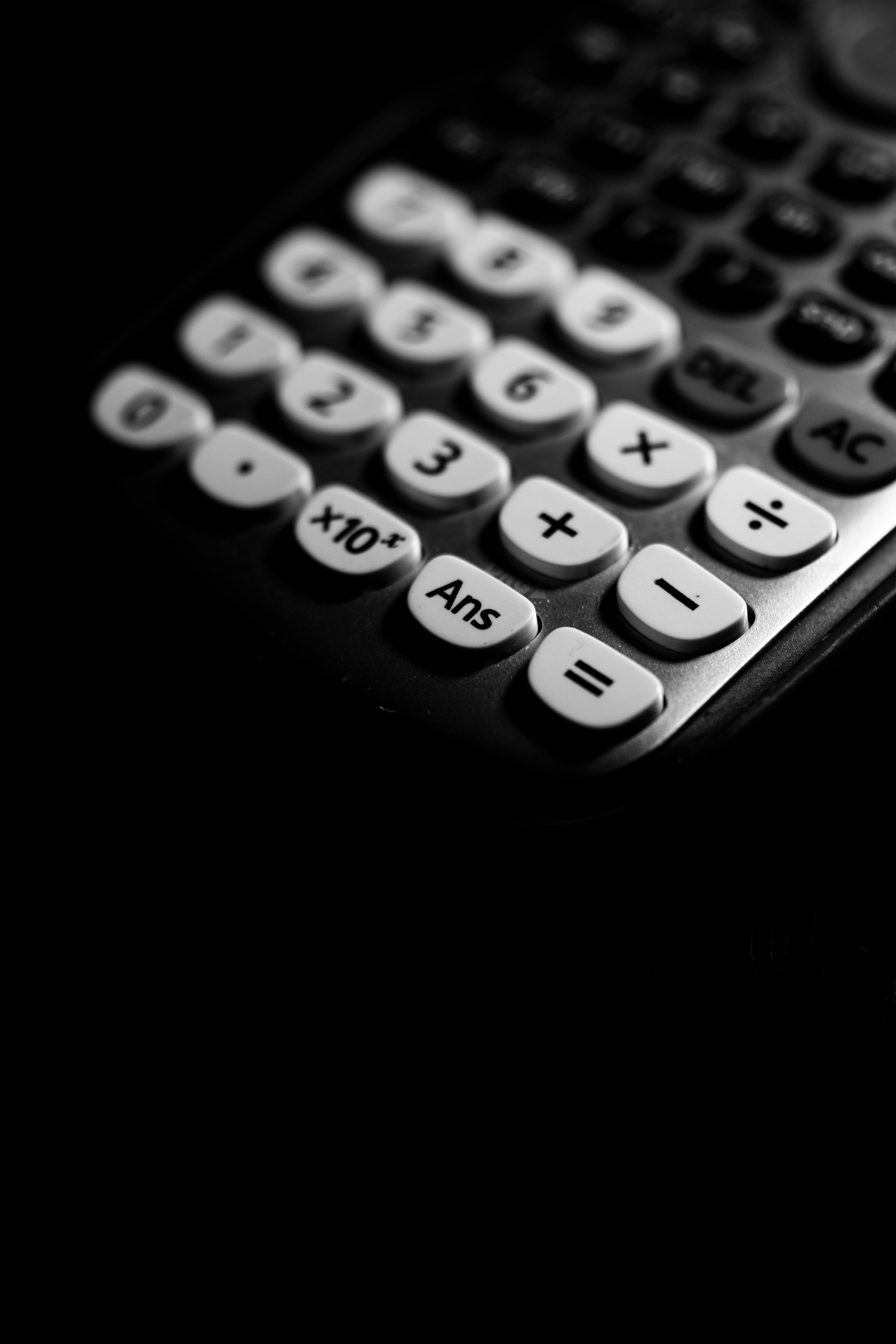 Black and Gray Calculator on Black Background · Free Stock Photo