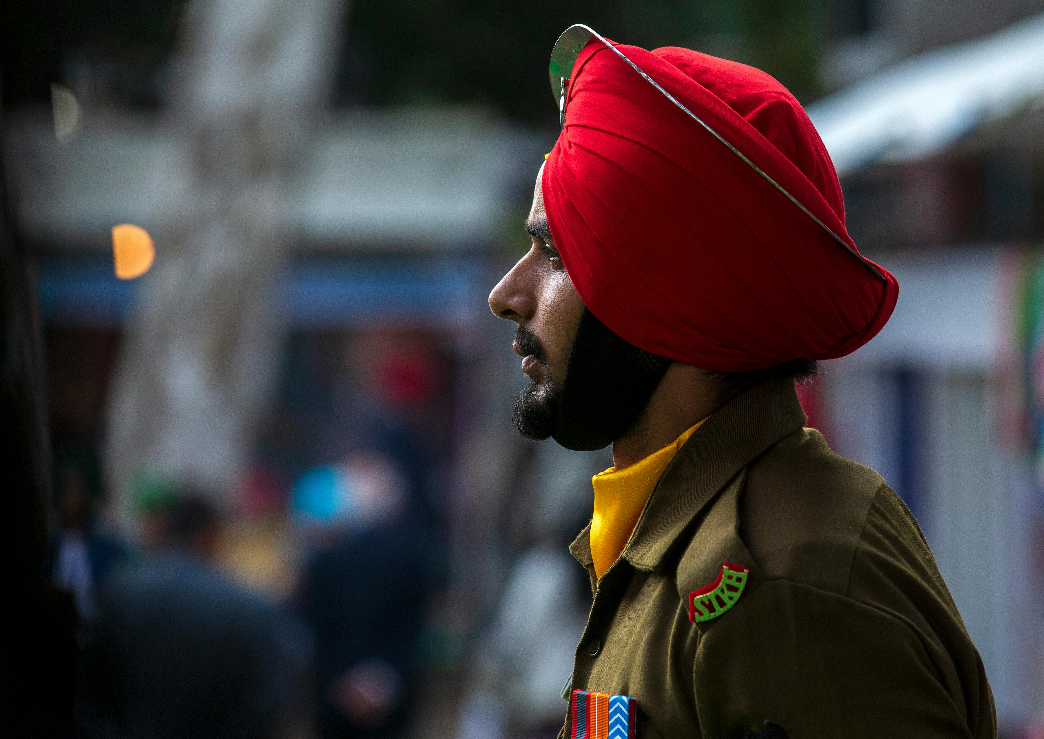 Man in Red Turban and Brown Uniform · Free Stock Photo