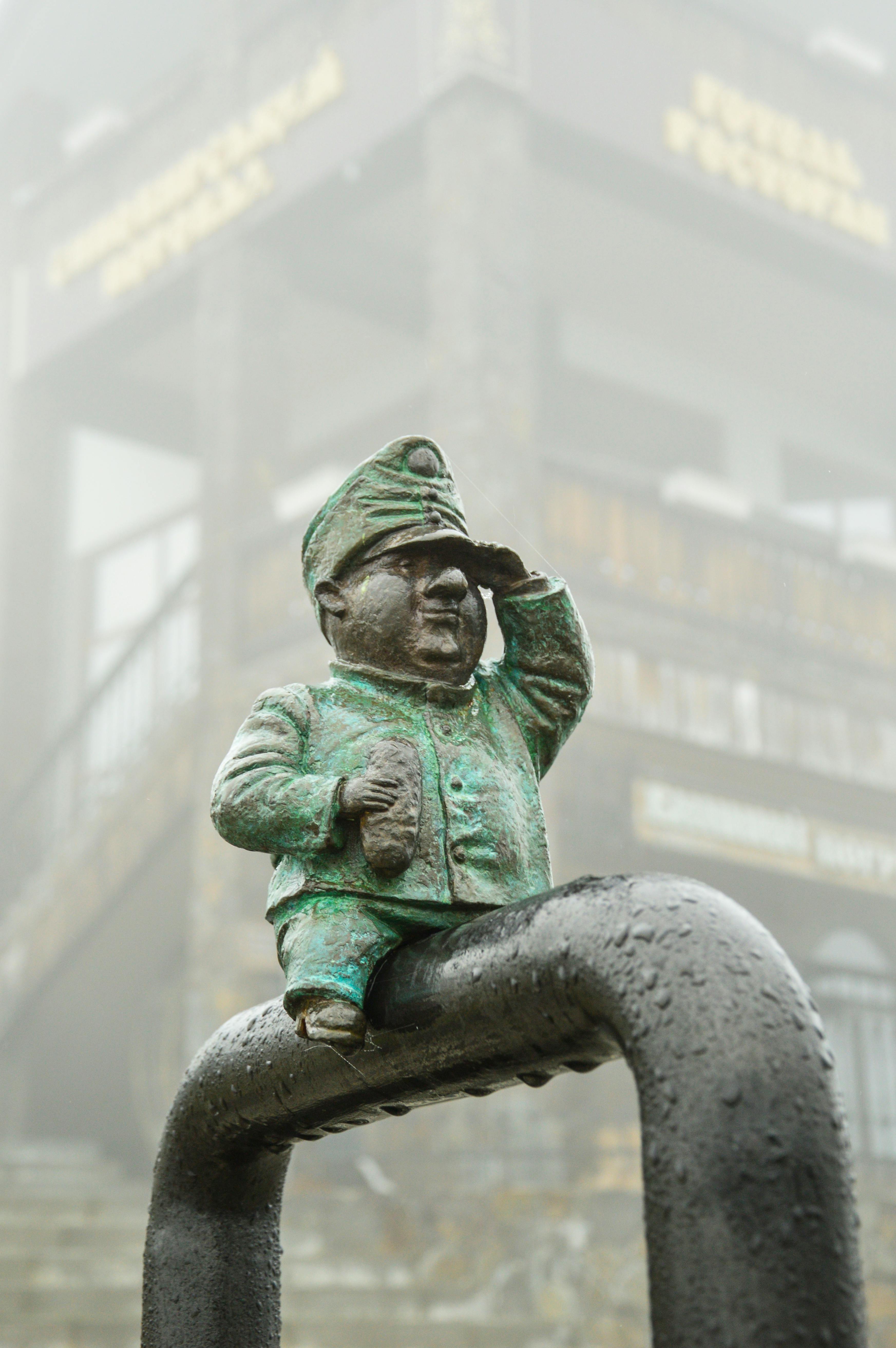 Metal Railing with a Saluting Soldier Sculpture, on a Rainy Day · Free ...