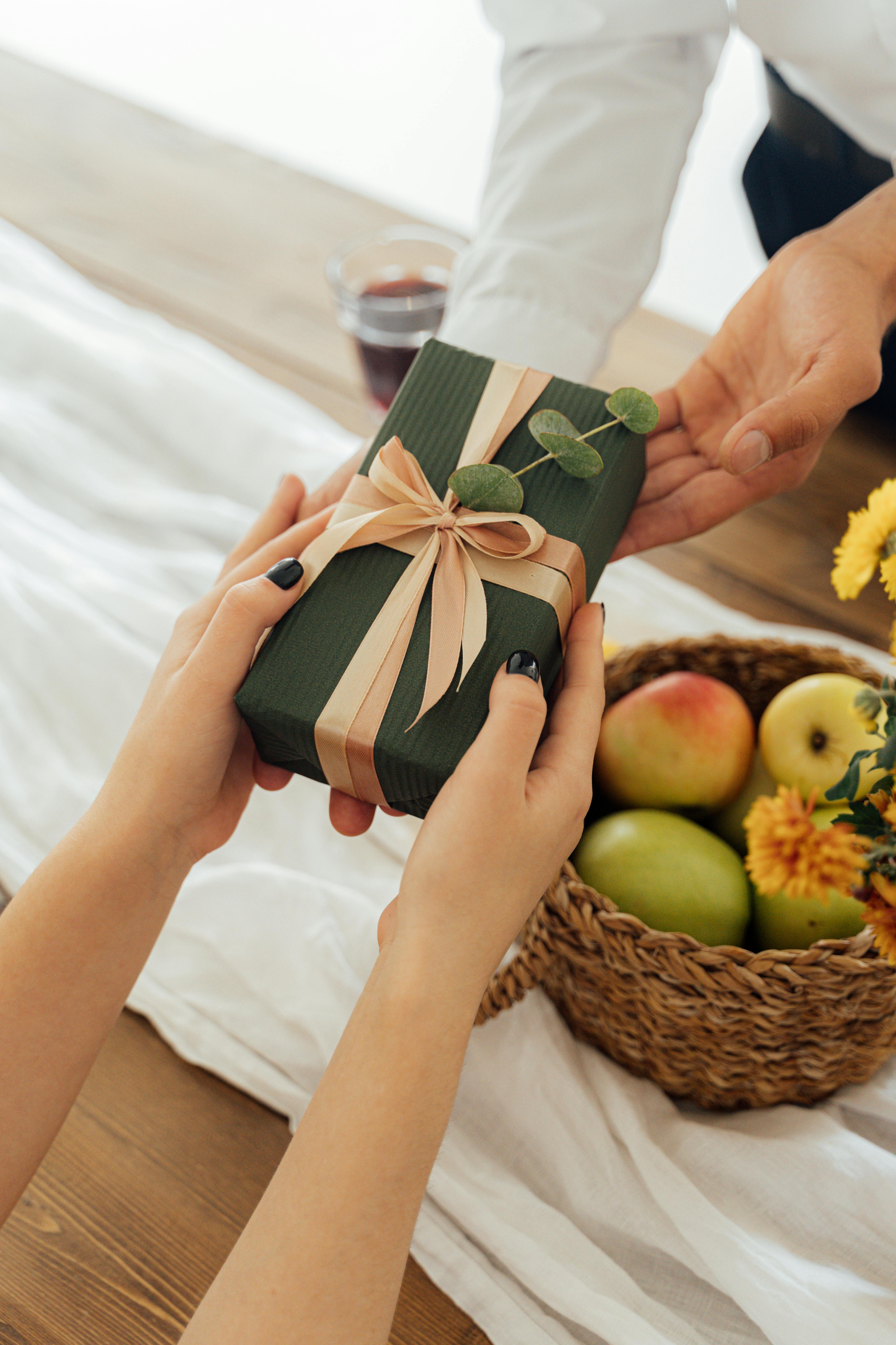 A Person Holding a Present · Free Stock Photo