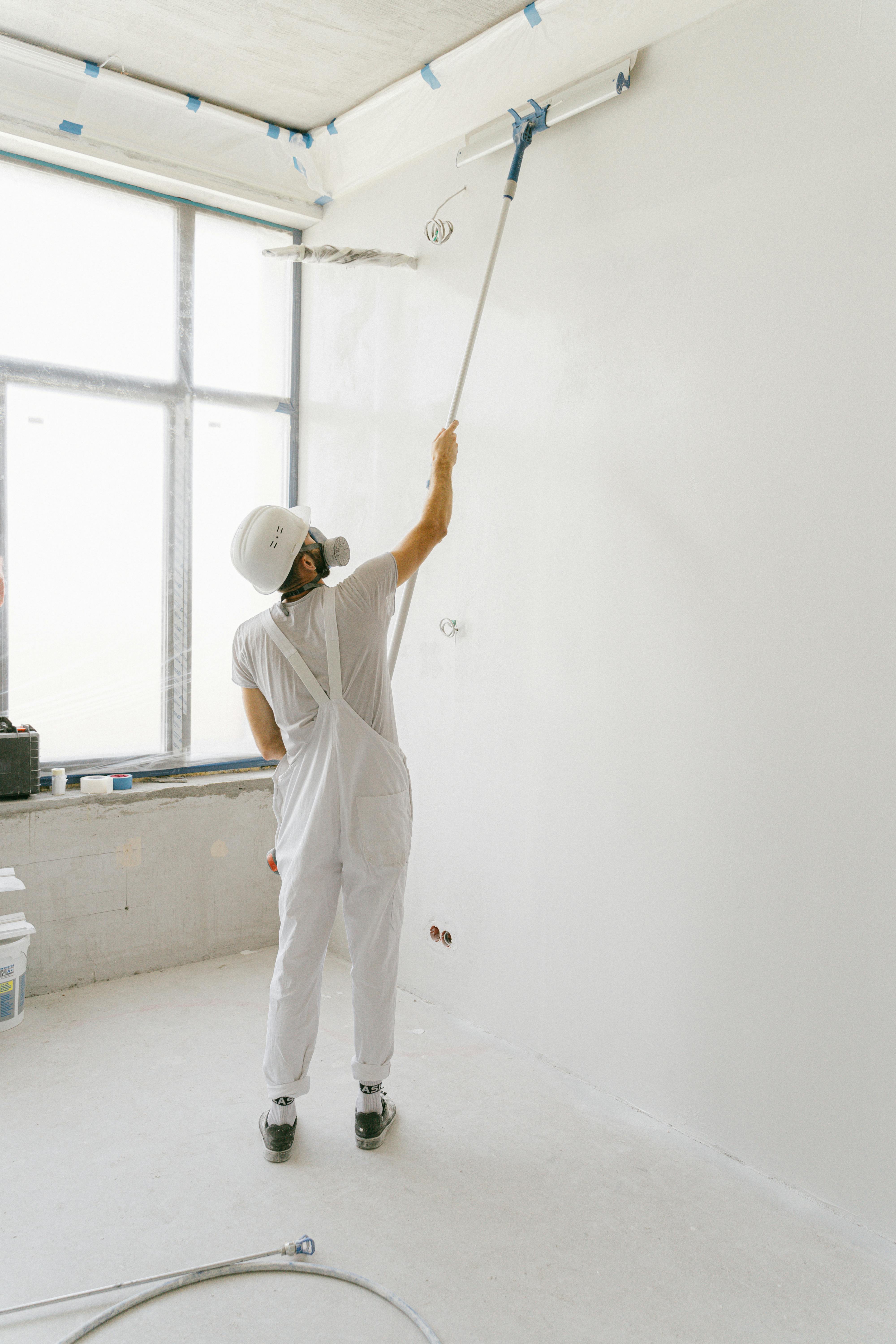 Man Painting a Wall · Free Stock Photo