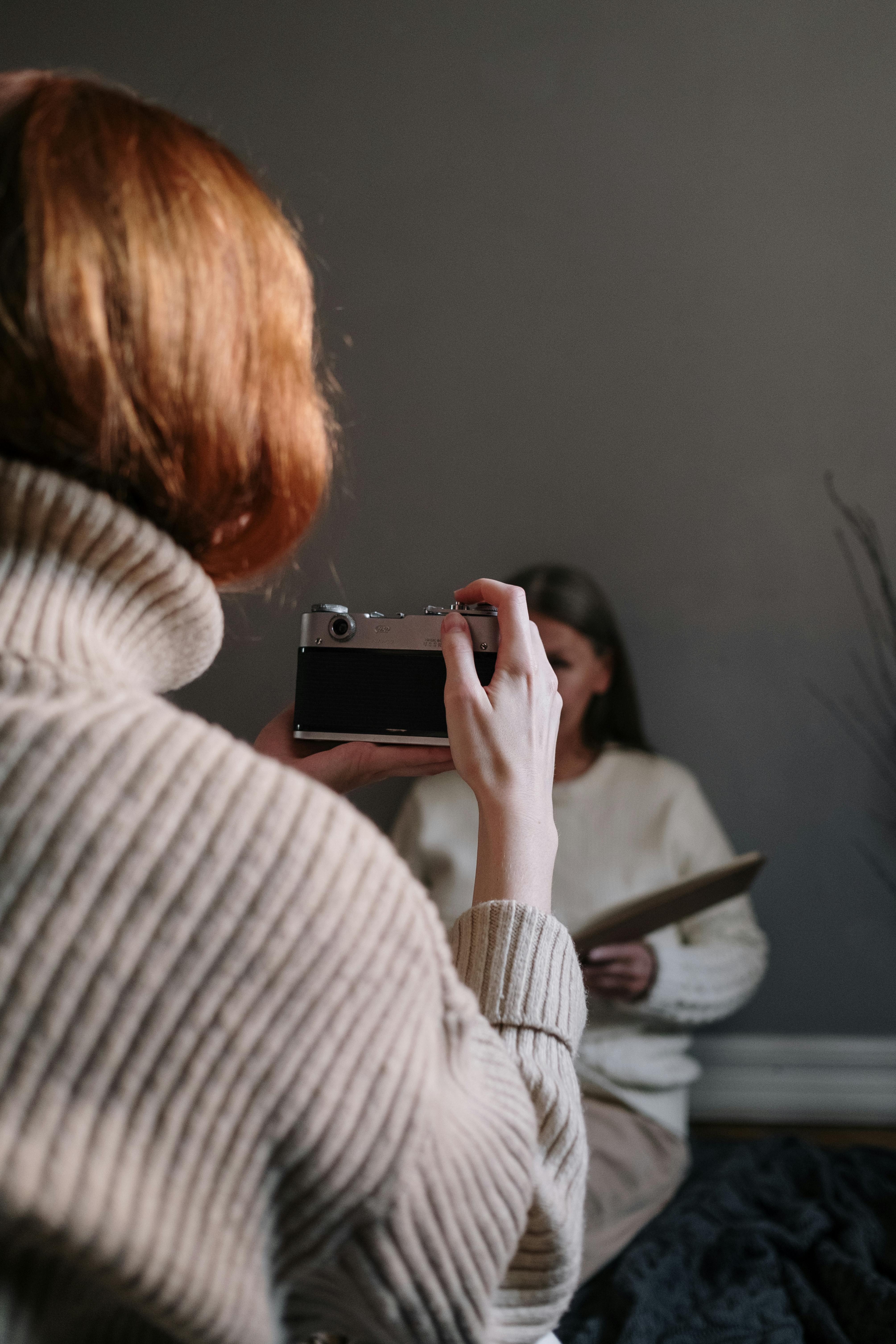 Photographer and a Model in a Photo Session · Free Stock Photo