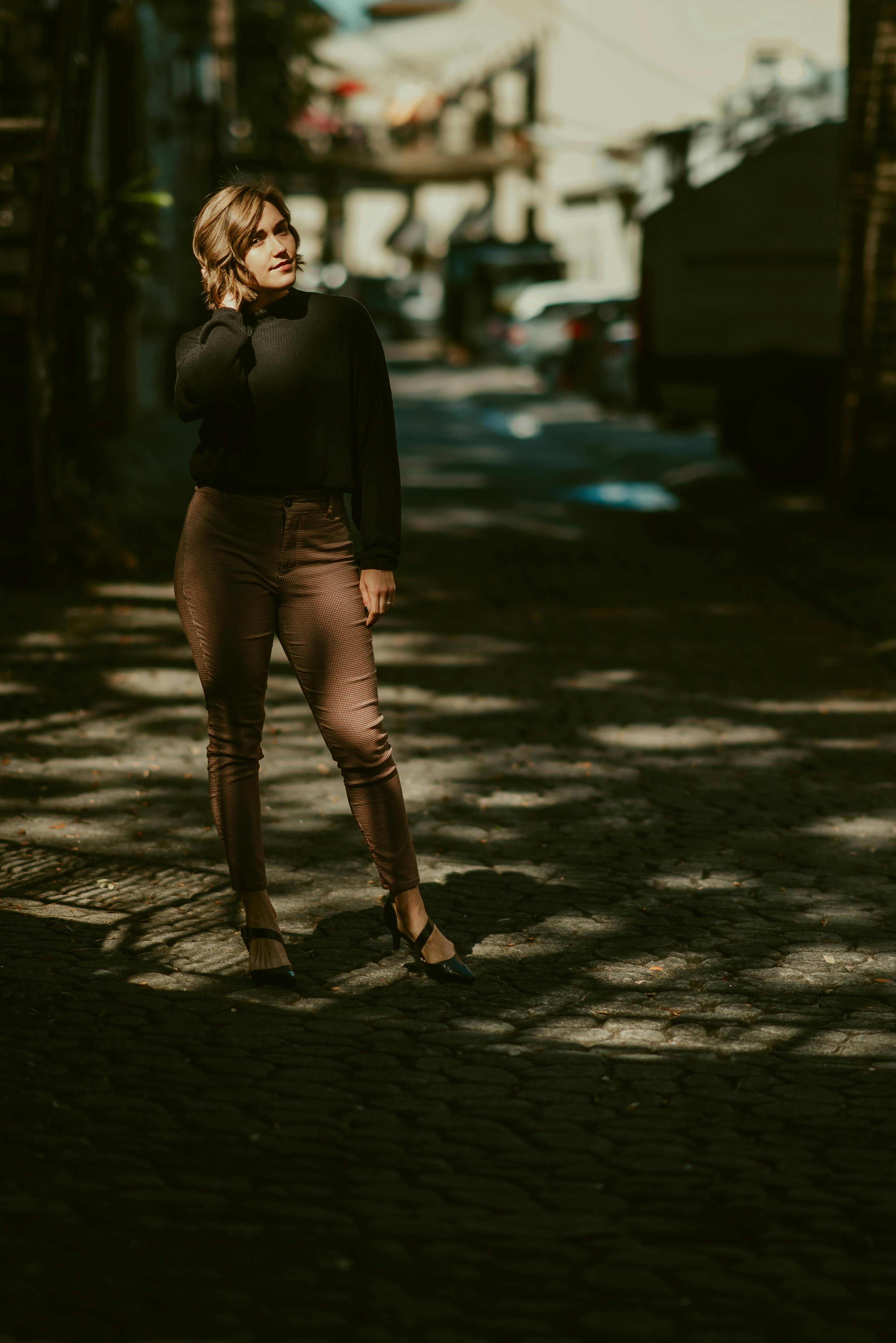 Stylish woman standing on street · Free Stock Photo