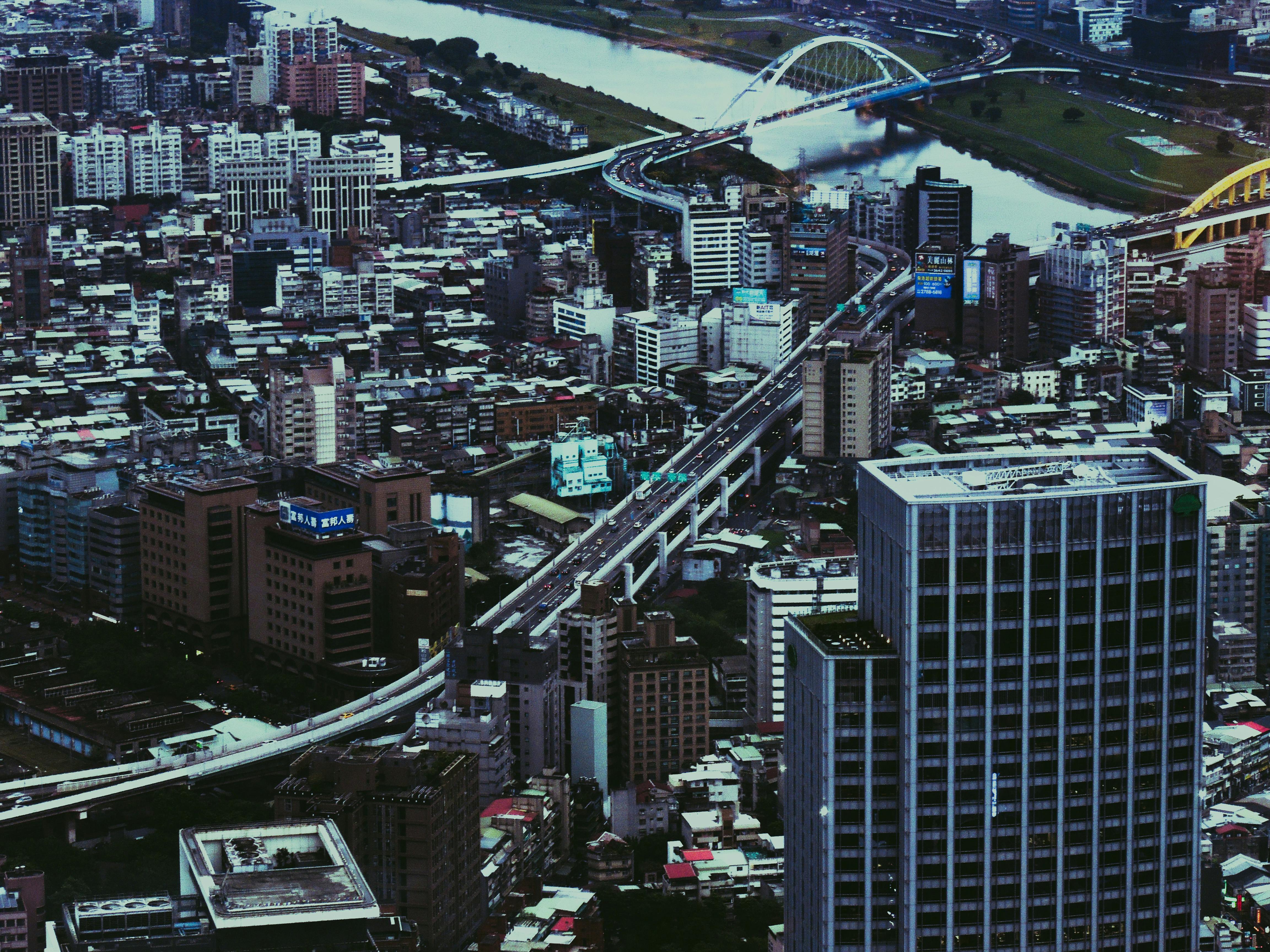Bridge over Water Near City Buildings · Free Stock Photo