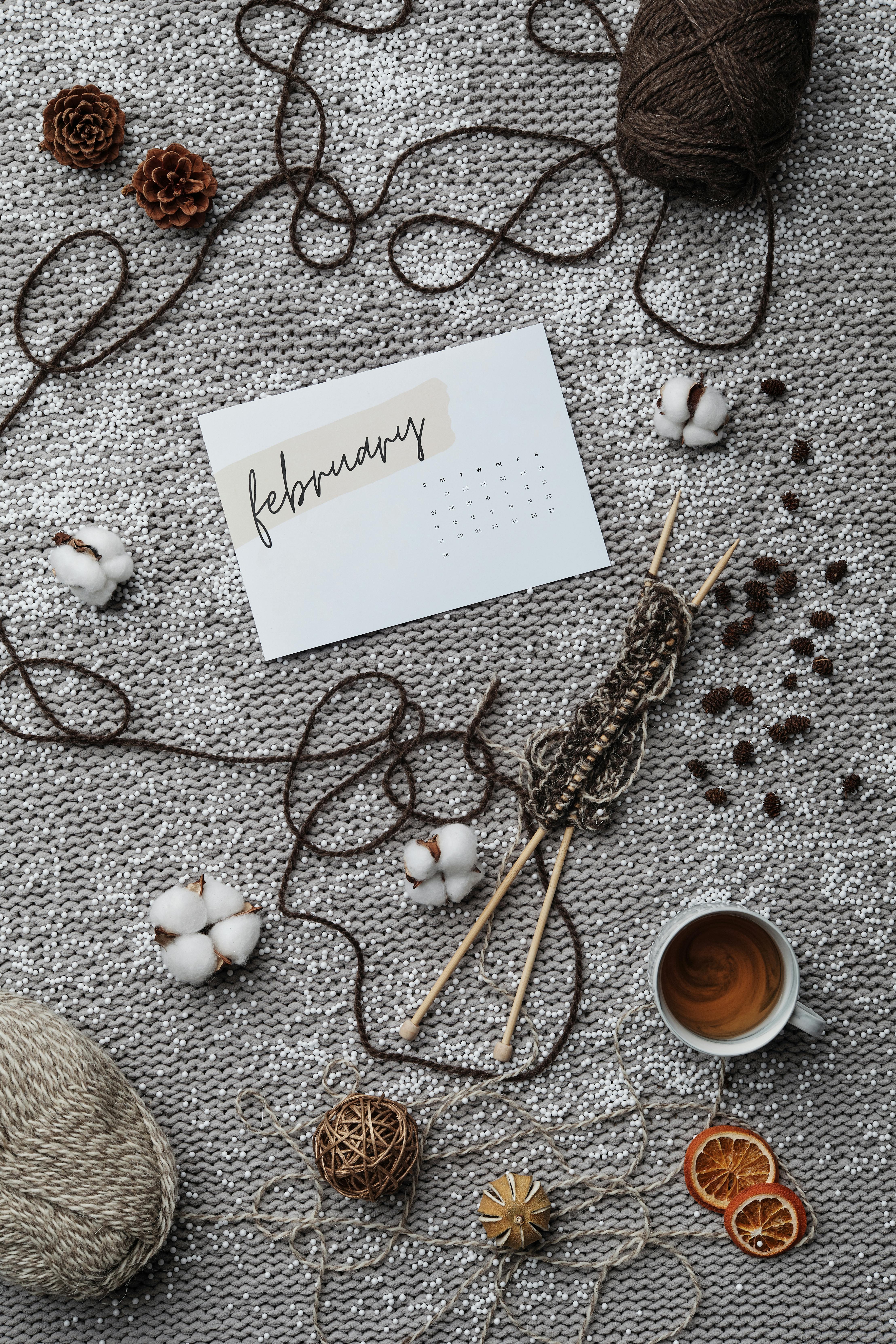 Flatlay of Crocheting Objects on a Gray Surface · Free Stock Photo