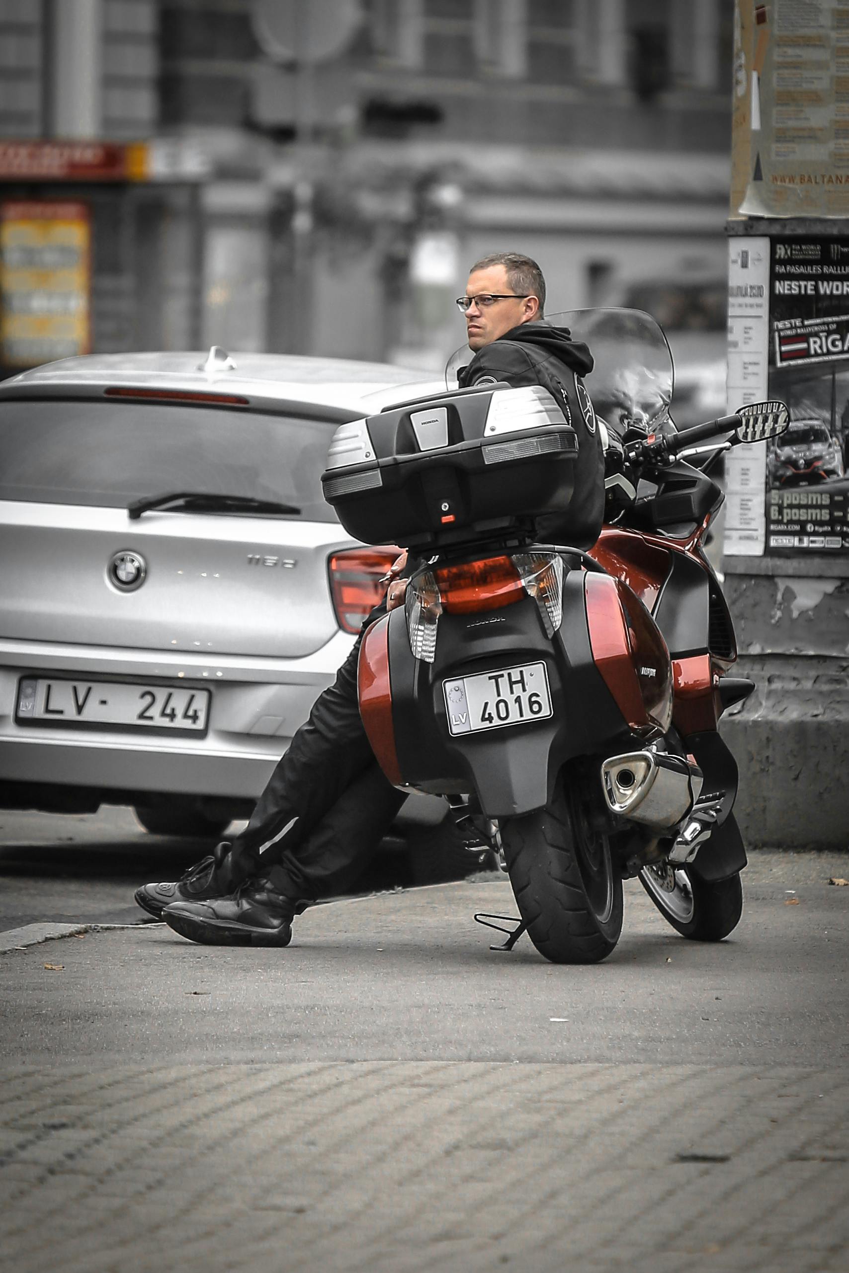 Man Leaning on a Motorcycle · Free Stock Photo
