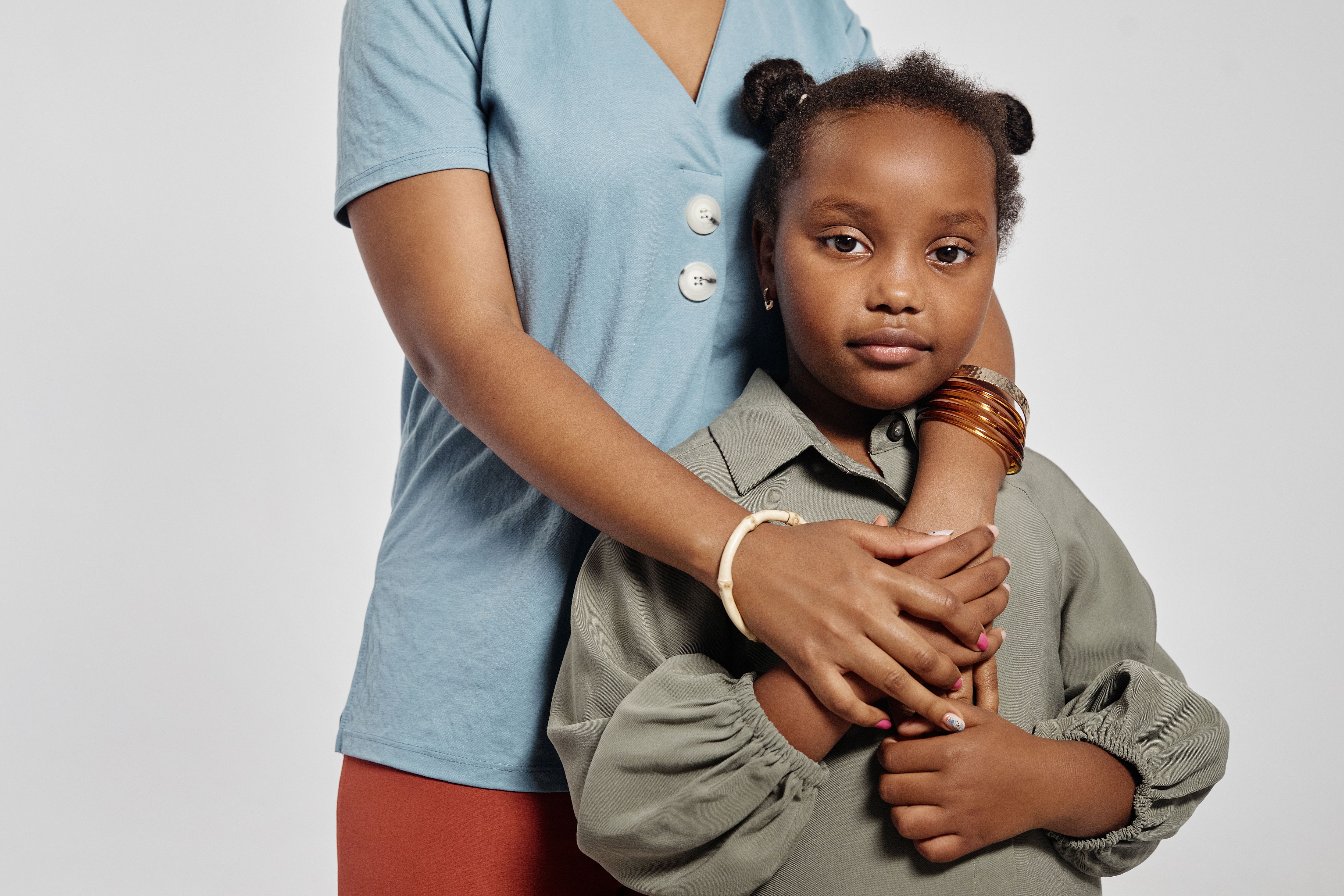Person Hugging a Kid · Free Stock Photo