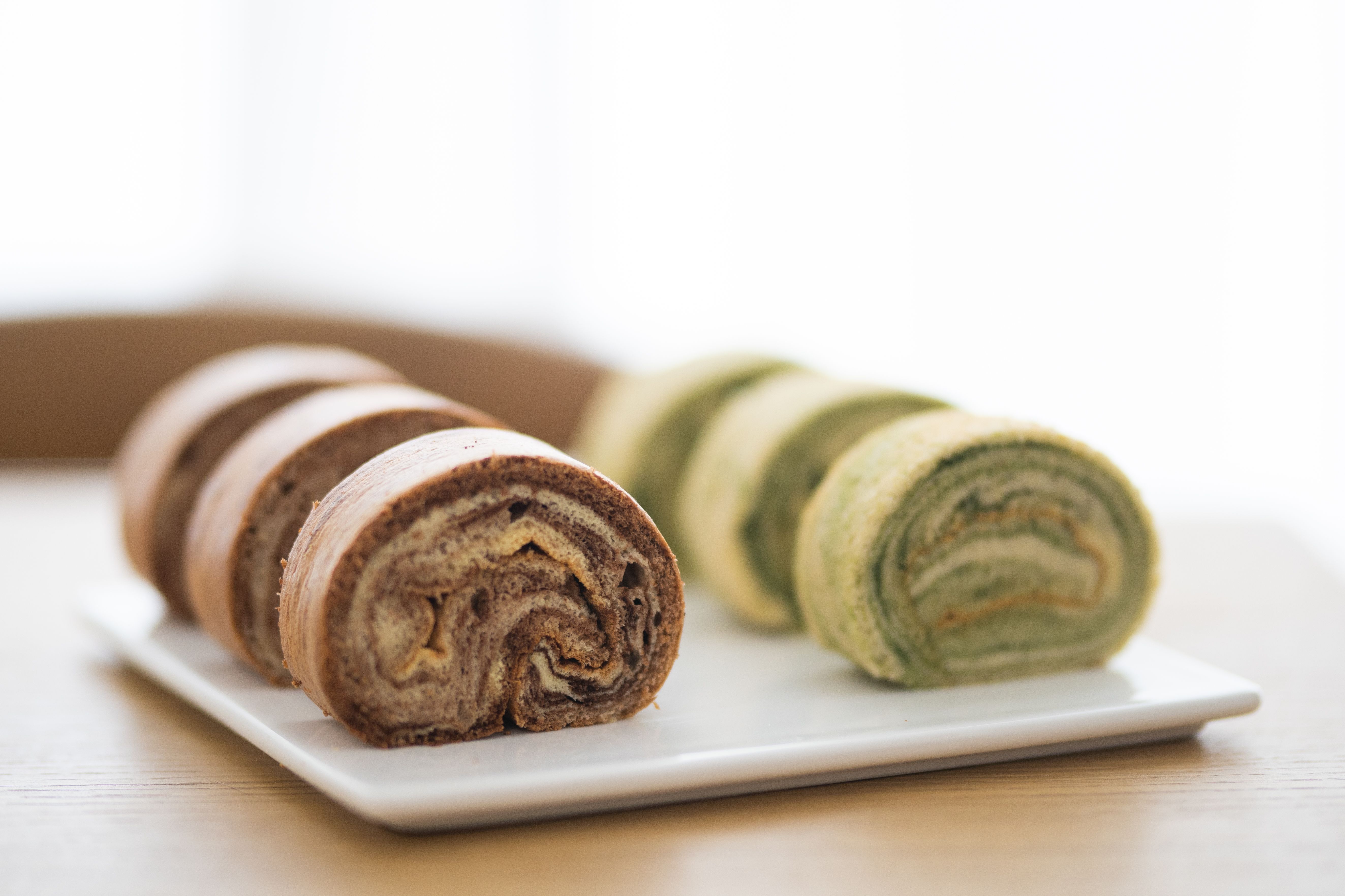 A Close-Up Shot of Sliced Cake Rolls · Free Stock Photo