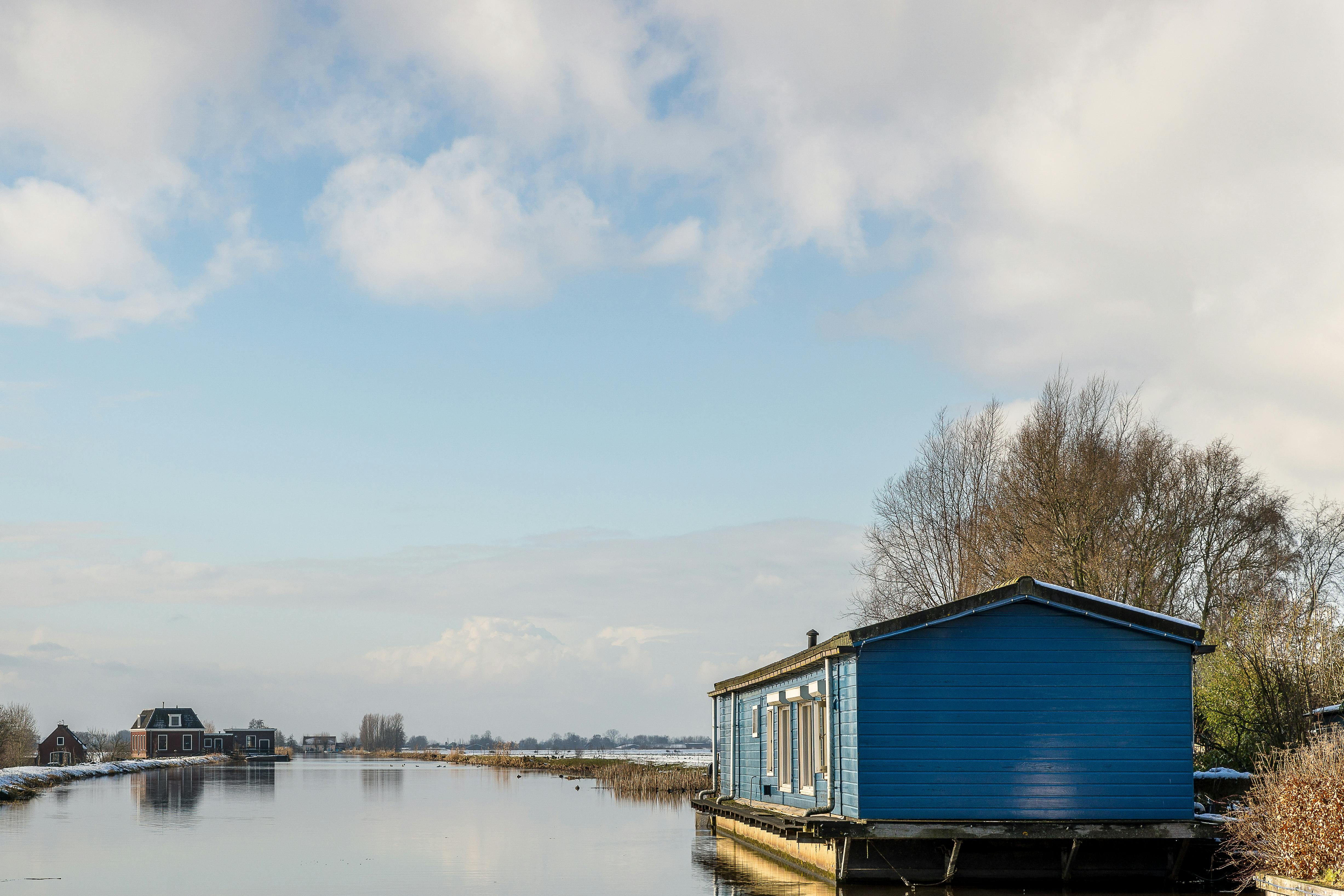 Blue Wooden House on the Lake · Free Stock Photo