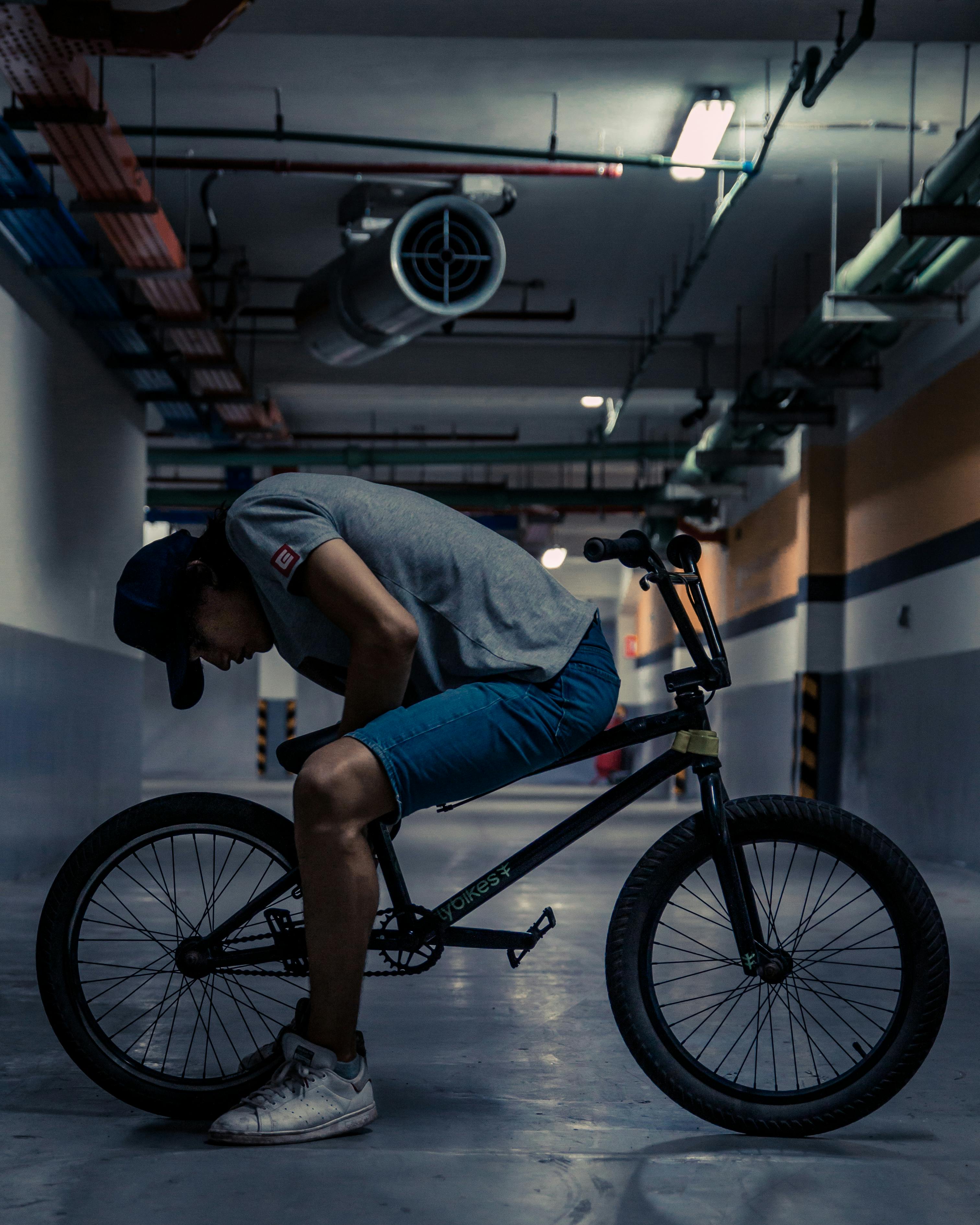 Man Sitting on a Bicycle · Free Stock Photo