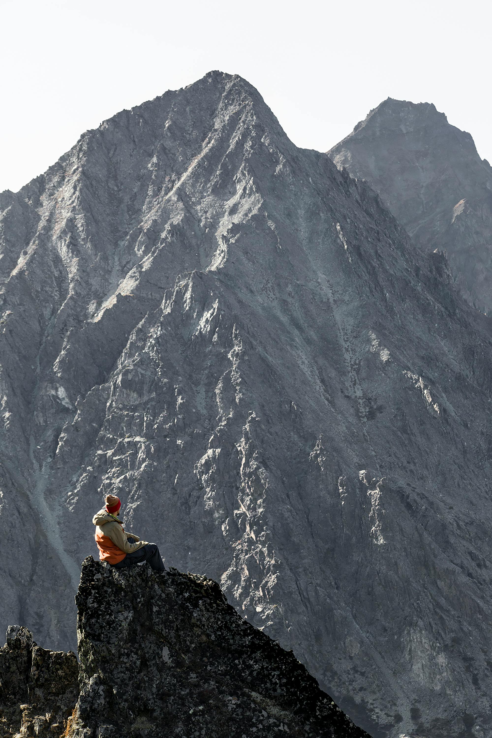 A Man Sitting on Top of the Mountain · Free Stock Photo