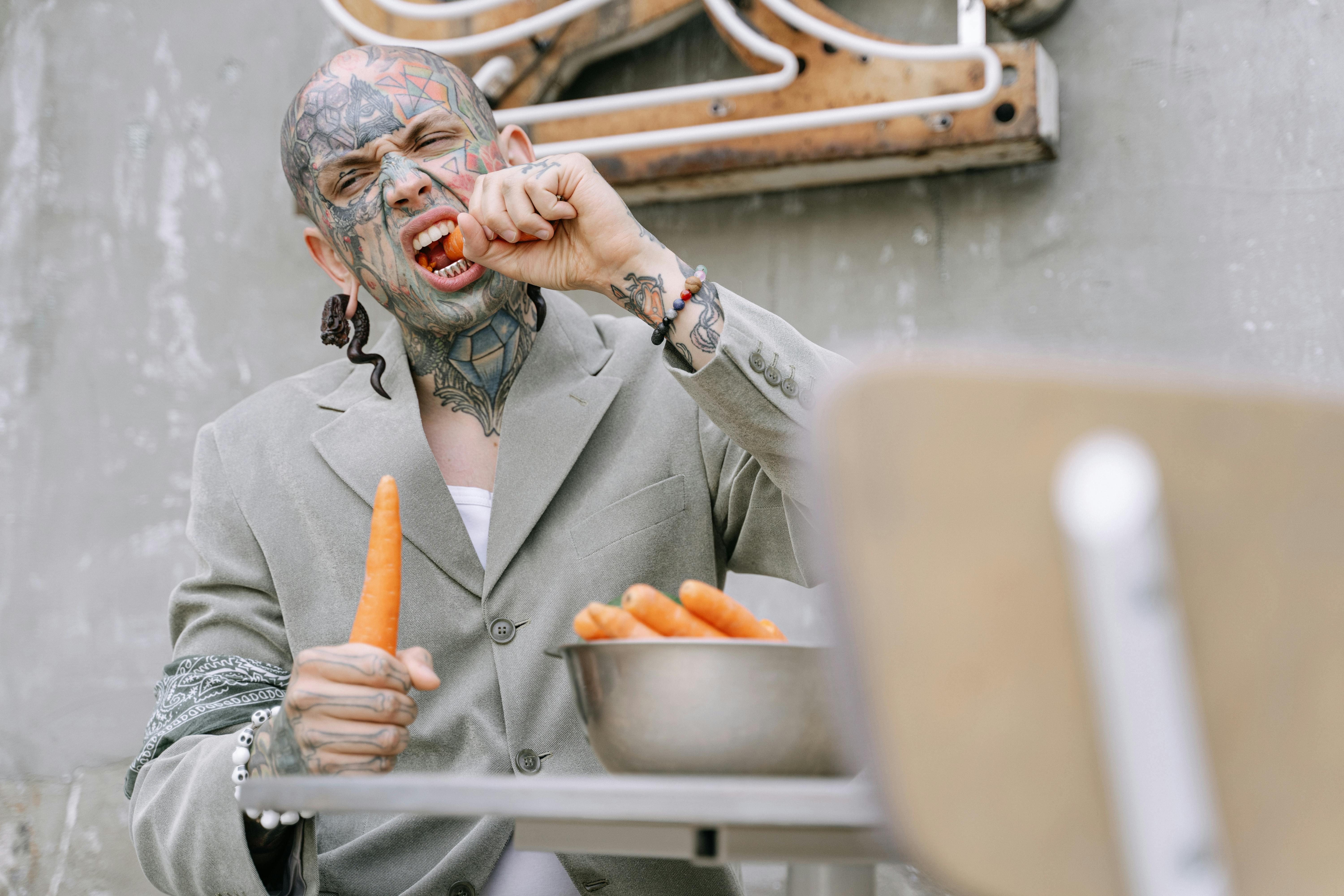 A Man Eating Carrots · Free Stock Photo