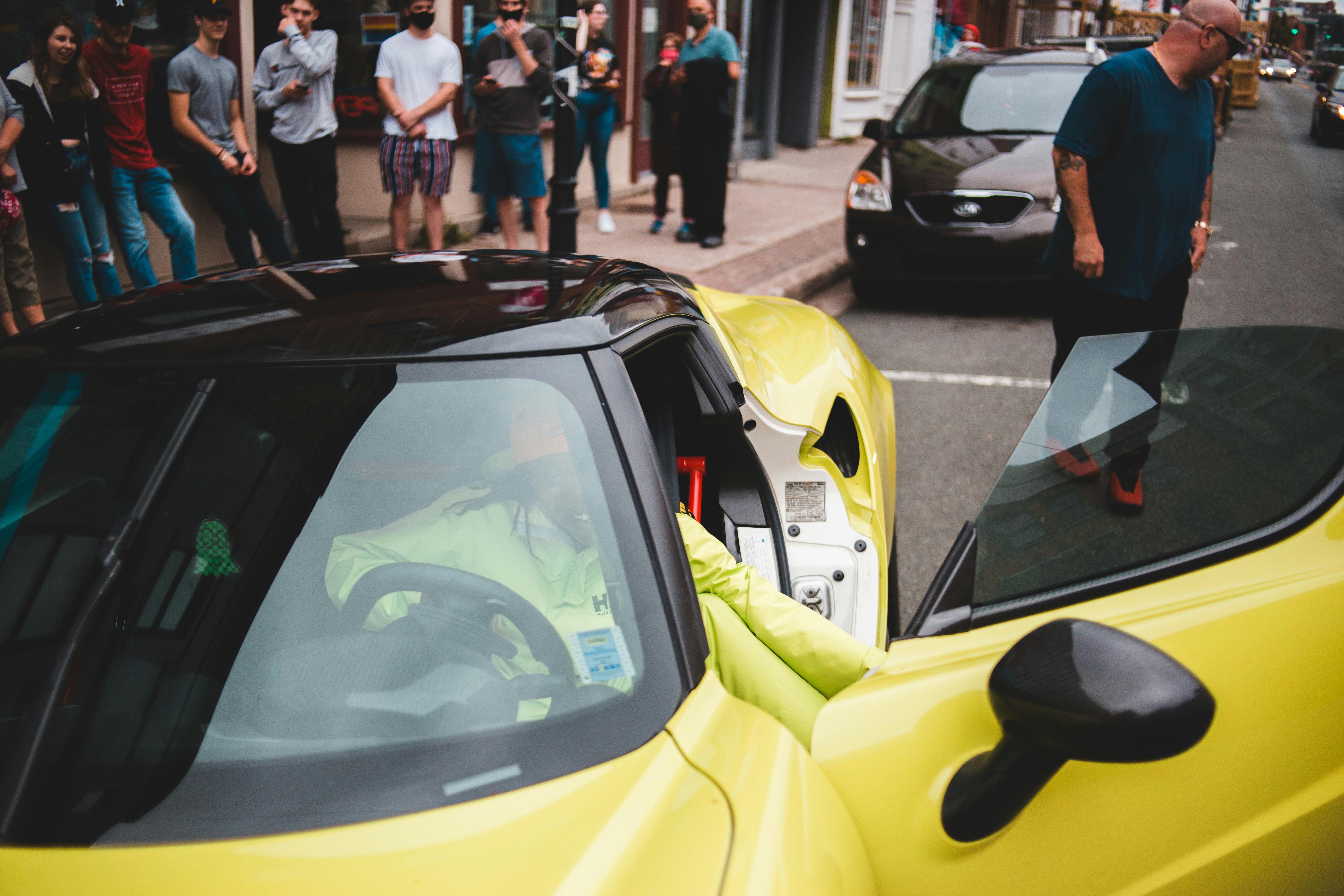 Unrecognizable driver opening door of luxury sports car · Free Stock Photo