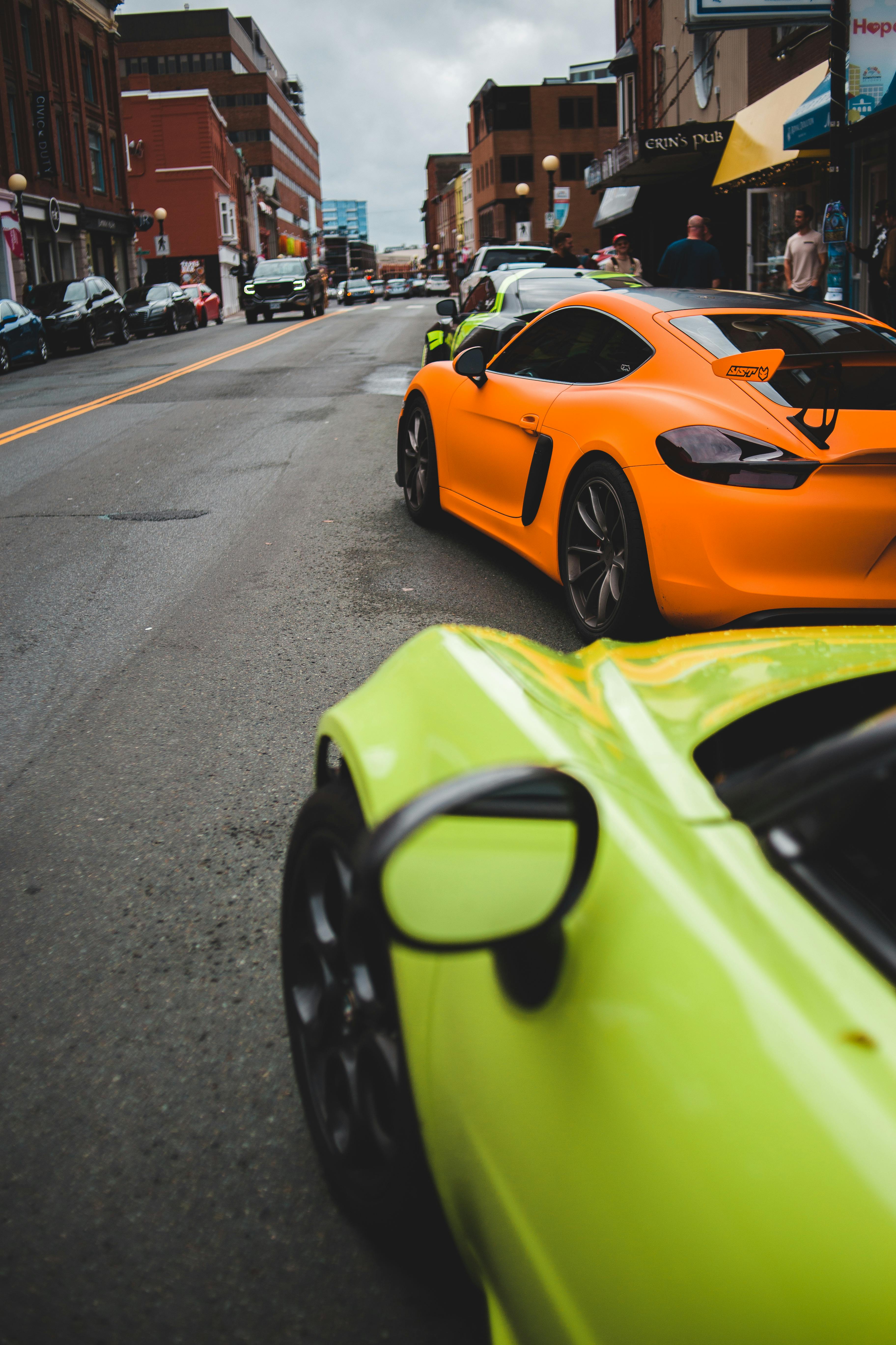 Photo Of Yellow Car Under Pink Trees · Free Stock Photo