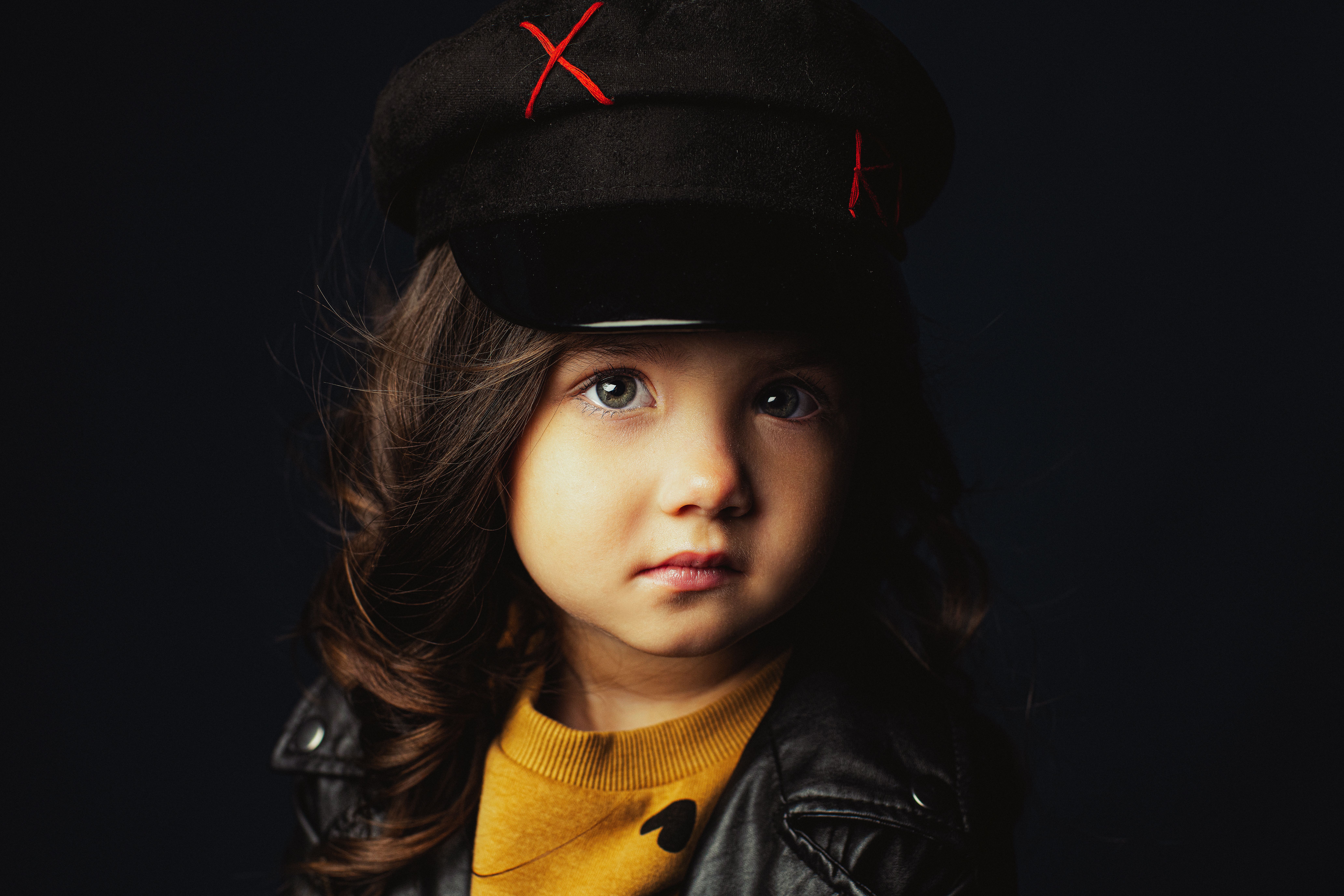 Close-Up Photo of a Cute Girl Wearing a Black Cap · Free Stock Photo